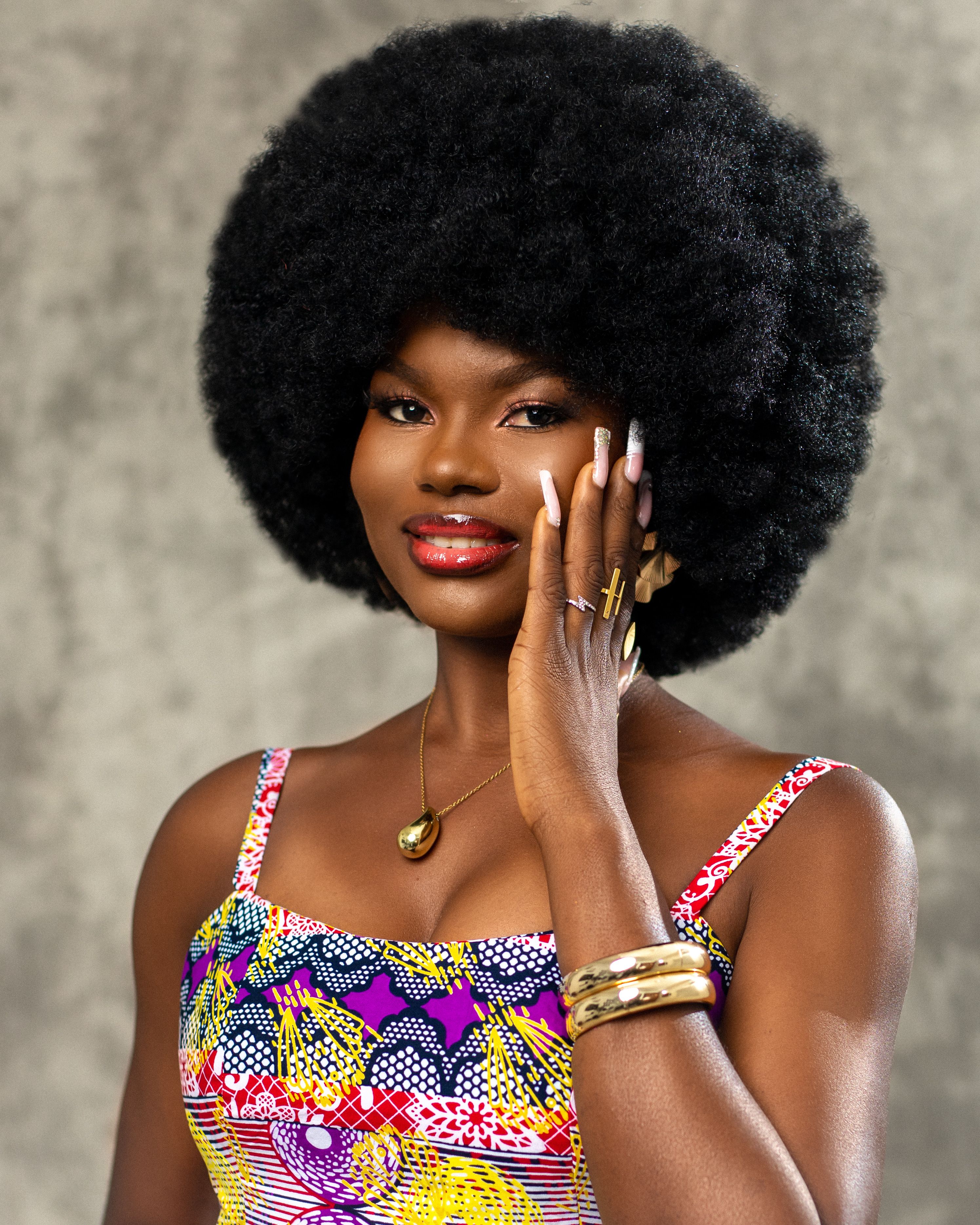 Portrait of Woman with Afro and Vibrant Dress · Free Stock Photo