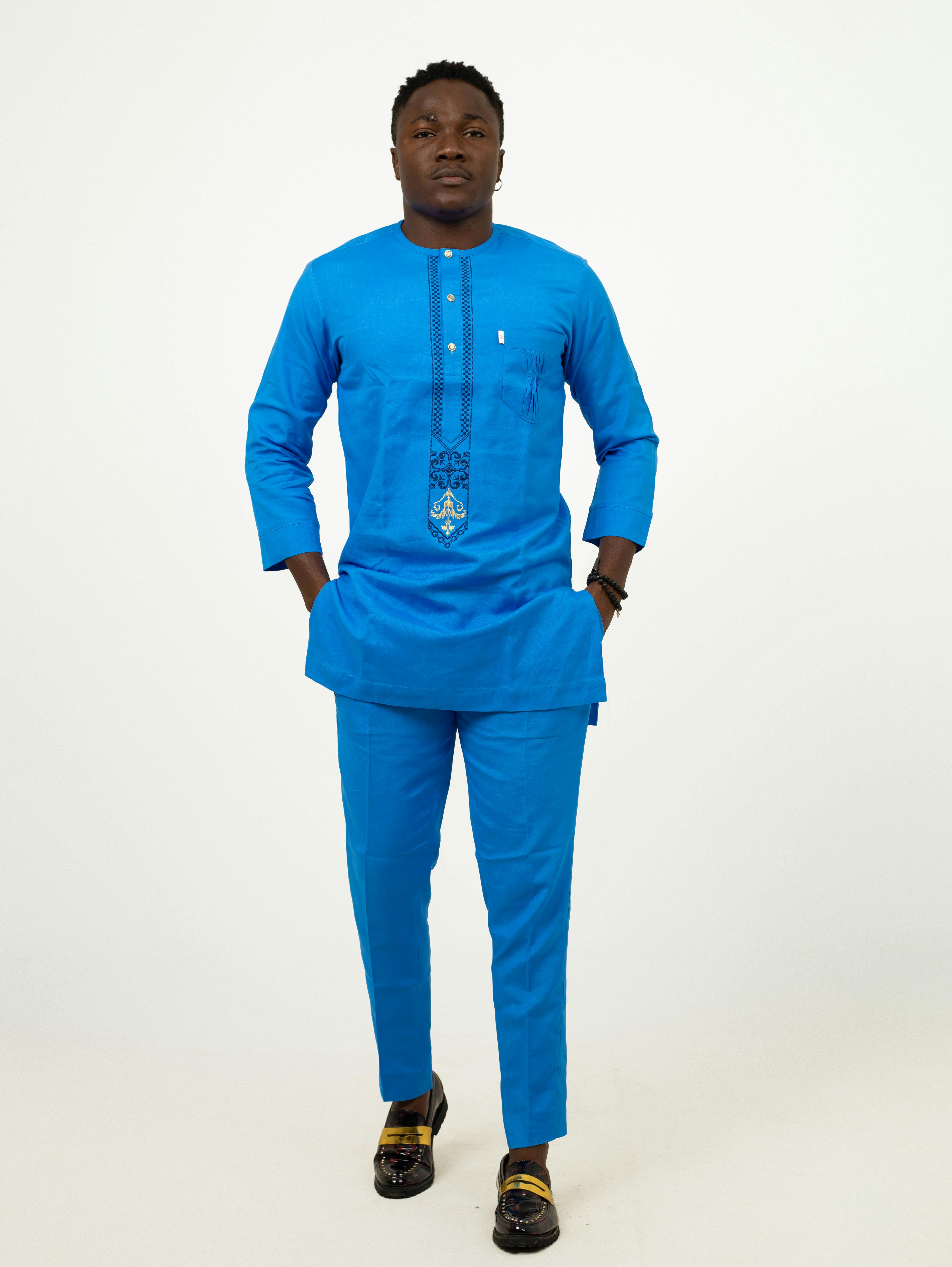 Elegant Portrait of Man in Blue Traditional Attire · Free Stock Photo