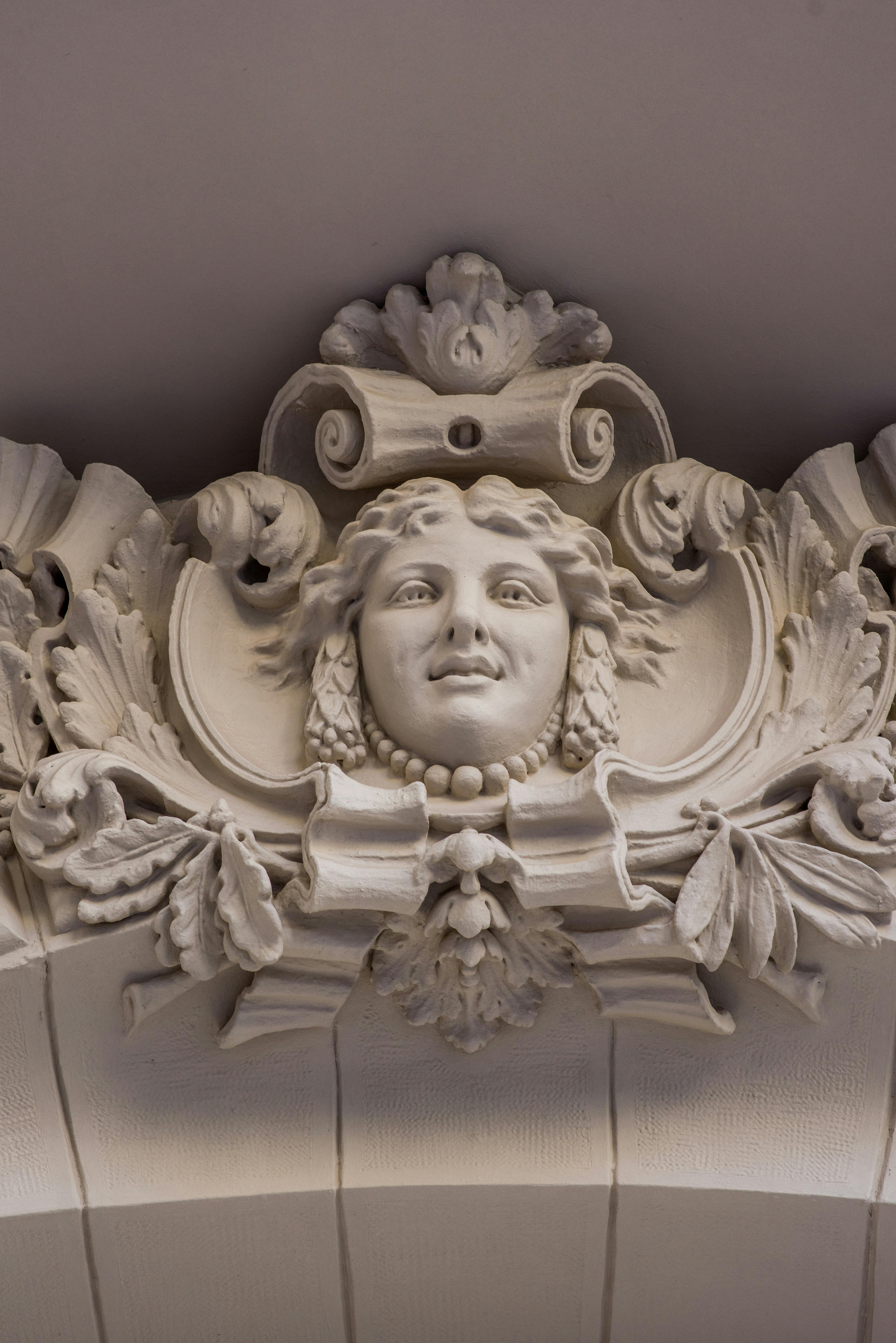Ornate Architectural Detail With Human Face Relief · Free Stock Photo