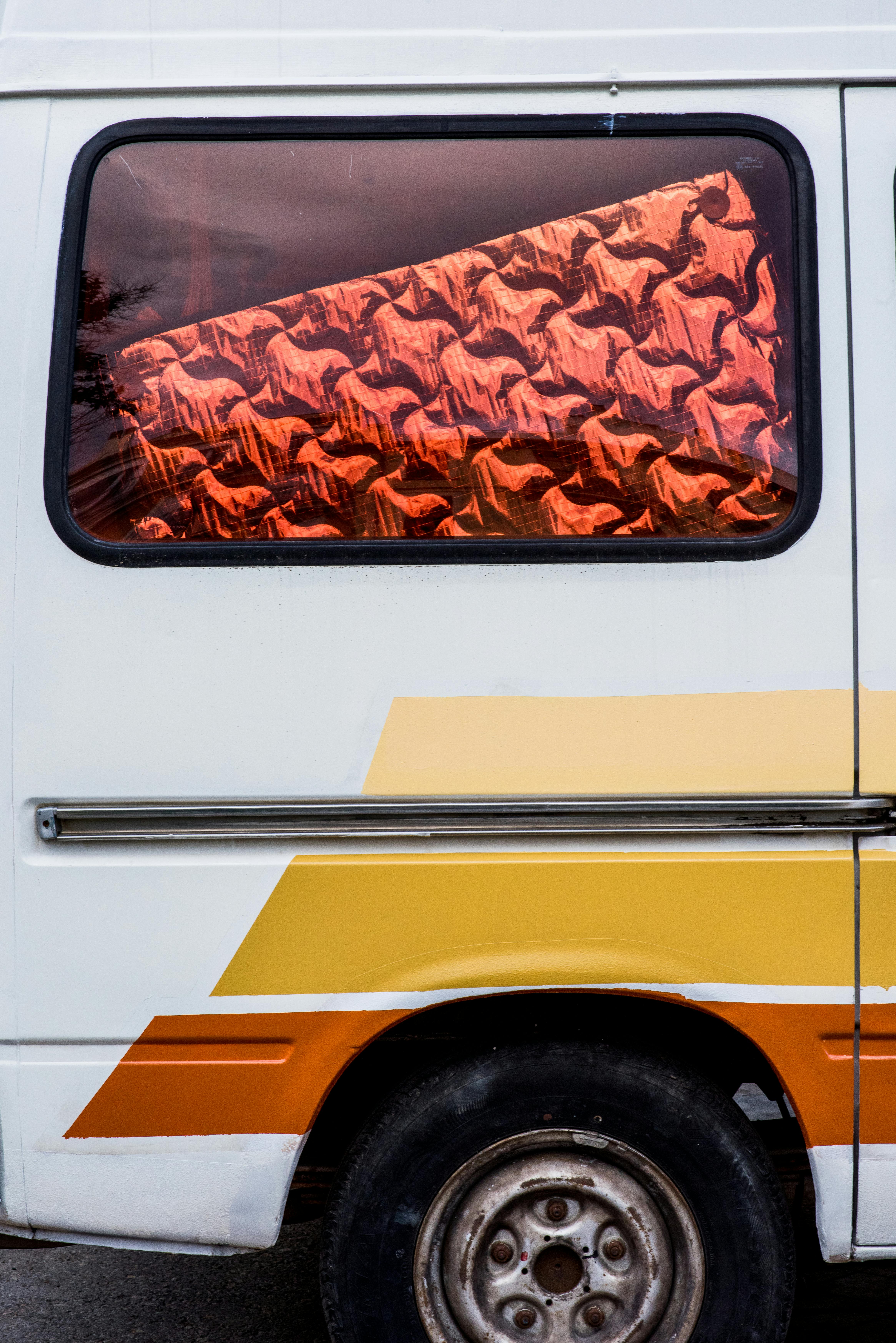 Colorful Reflection on Vehicle Window · Free Stock Photo