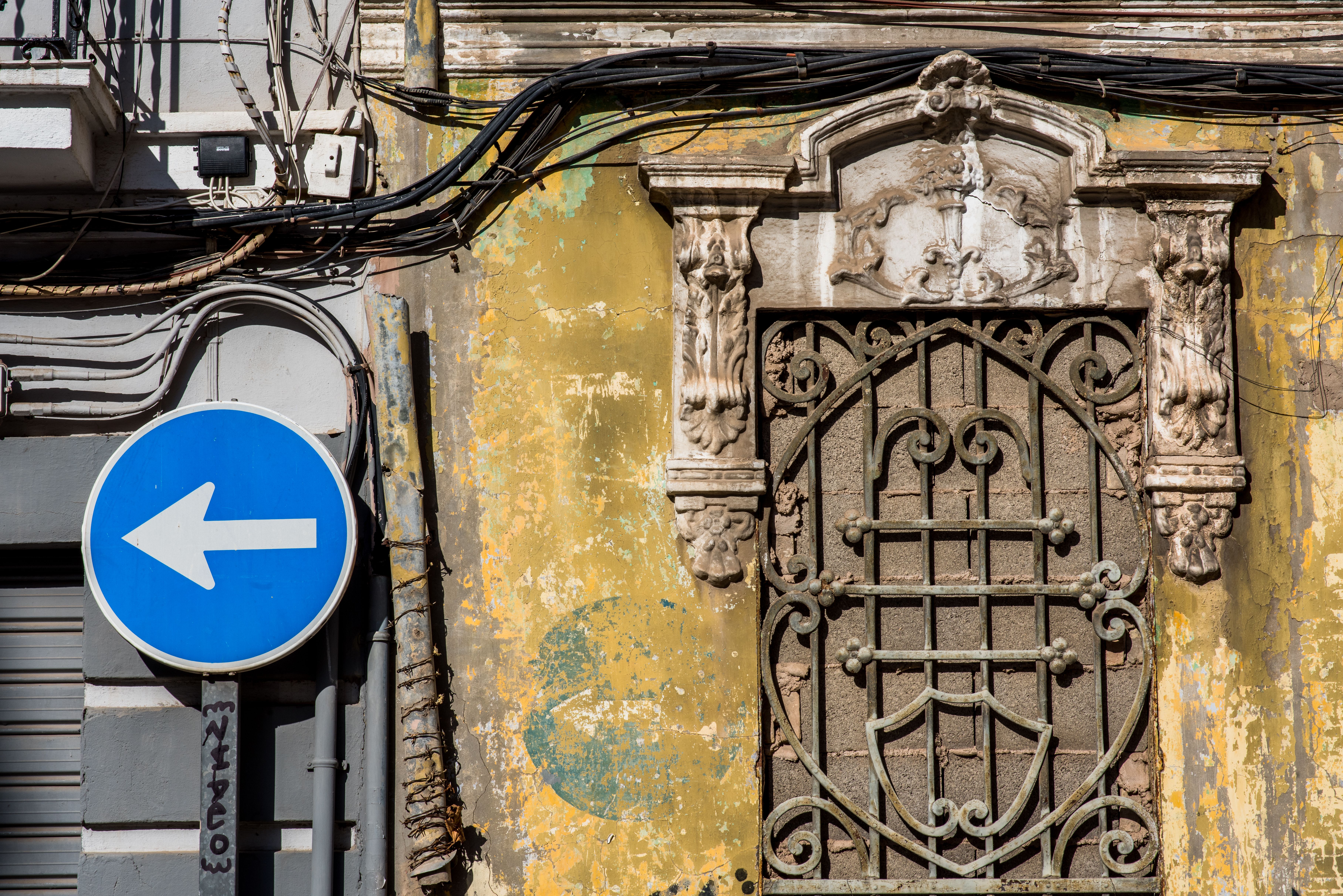 Urban Architectural Details with Blue Arrow Sign · Free Stock Photo