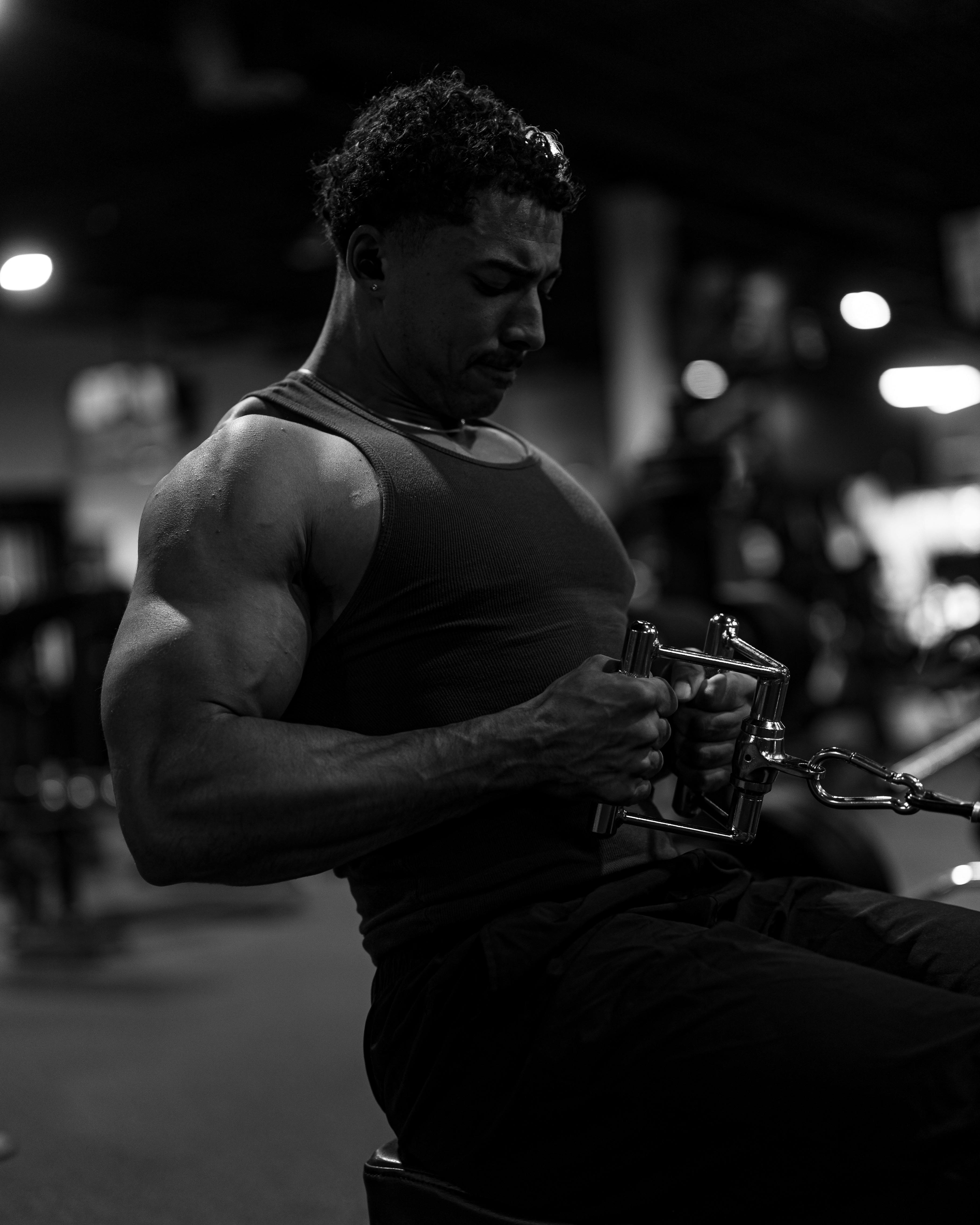 Strong Man Working Out in Gym with Cables · Free Stock Photo