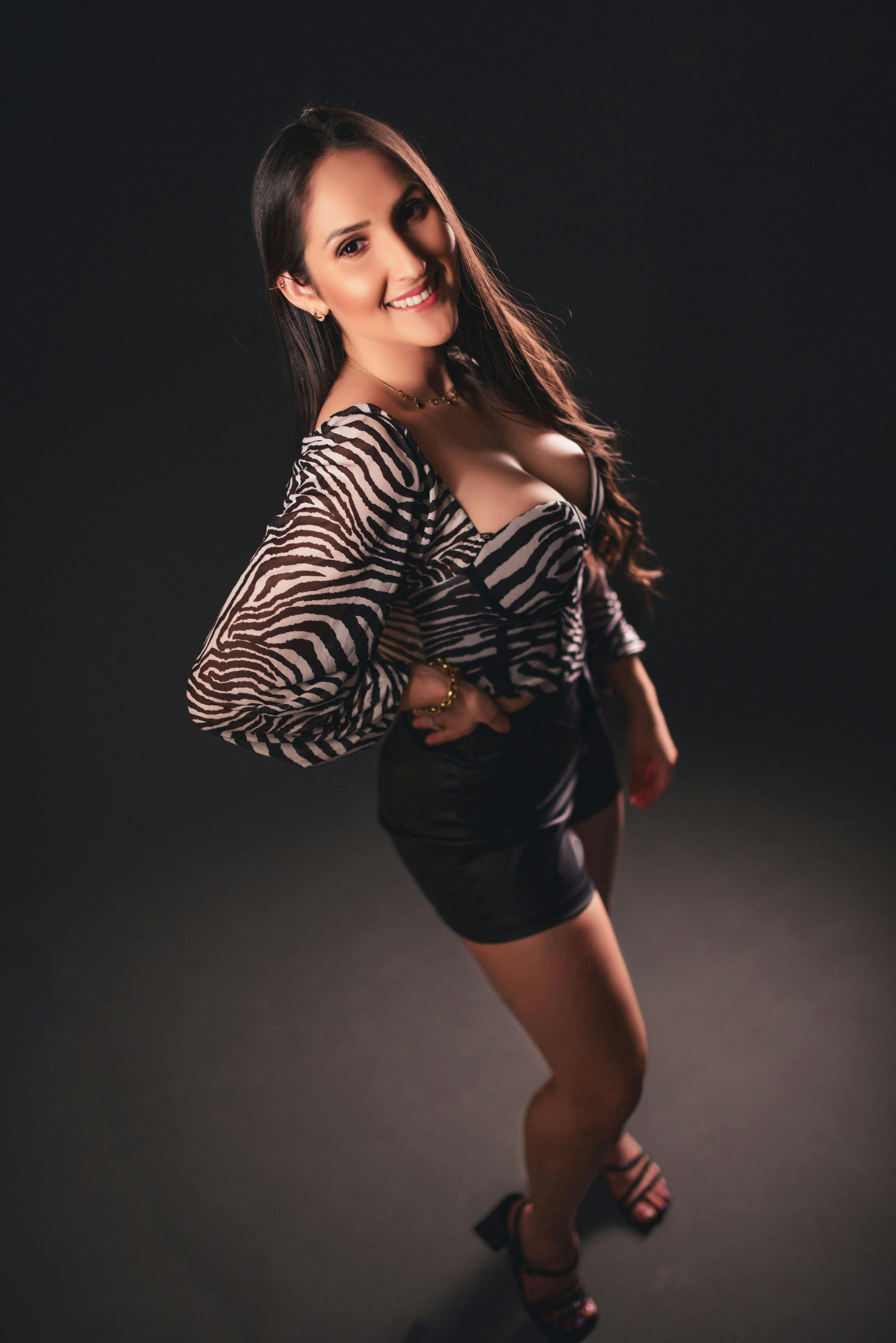 Confident Woman in Zebra Pattern Outfit · Free Stock Photo