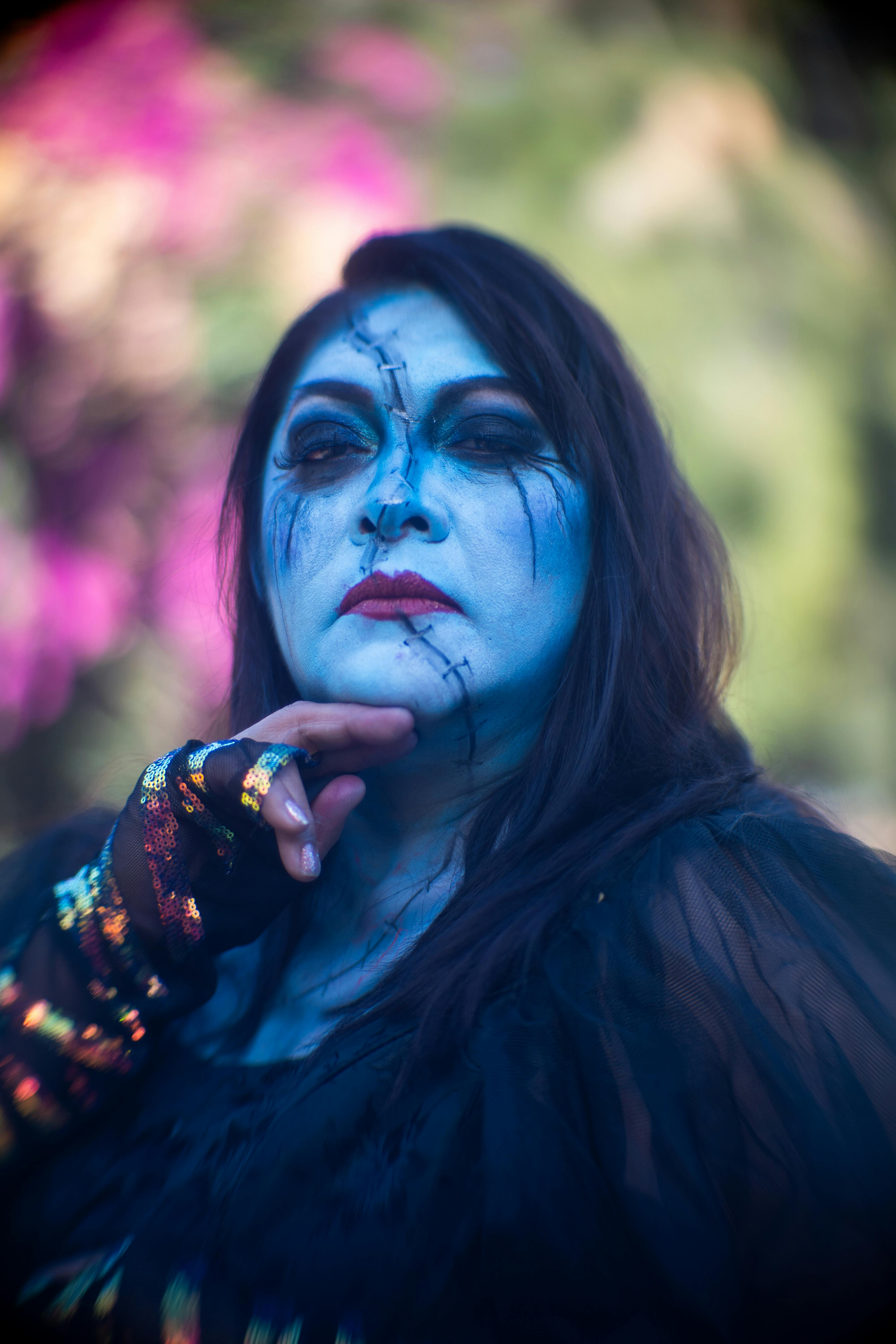 Mysterious Woman with Blue Face Makeup in Mexico City · Free Stock Photo