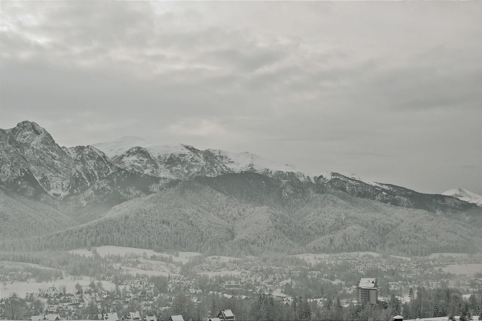 Wooden mountain village with Tatra peaks