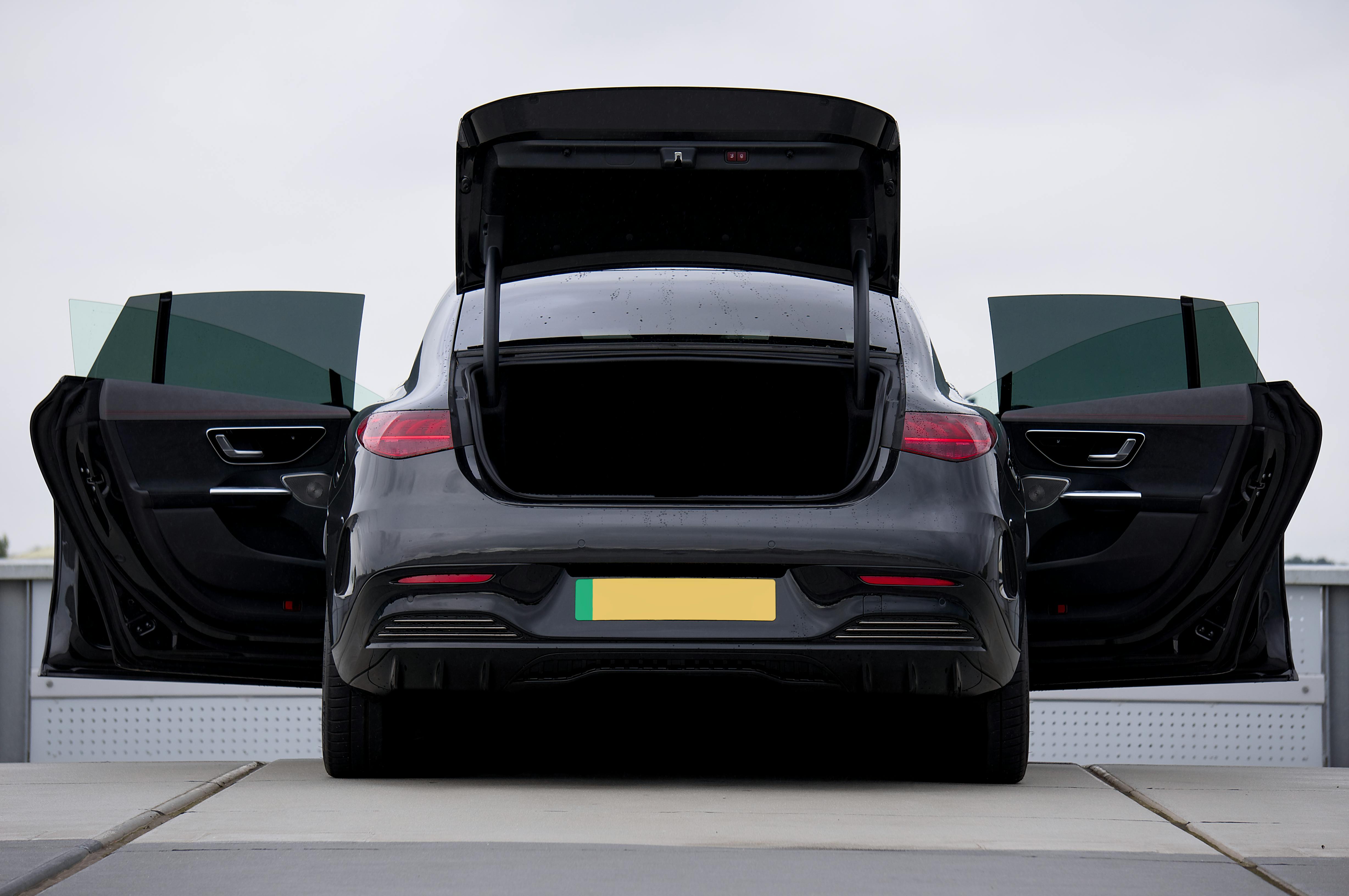 Rear View of a Modern Luxury Electric Vehicle · Free Stock Photo