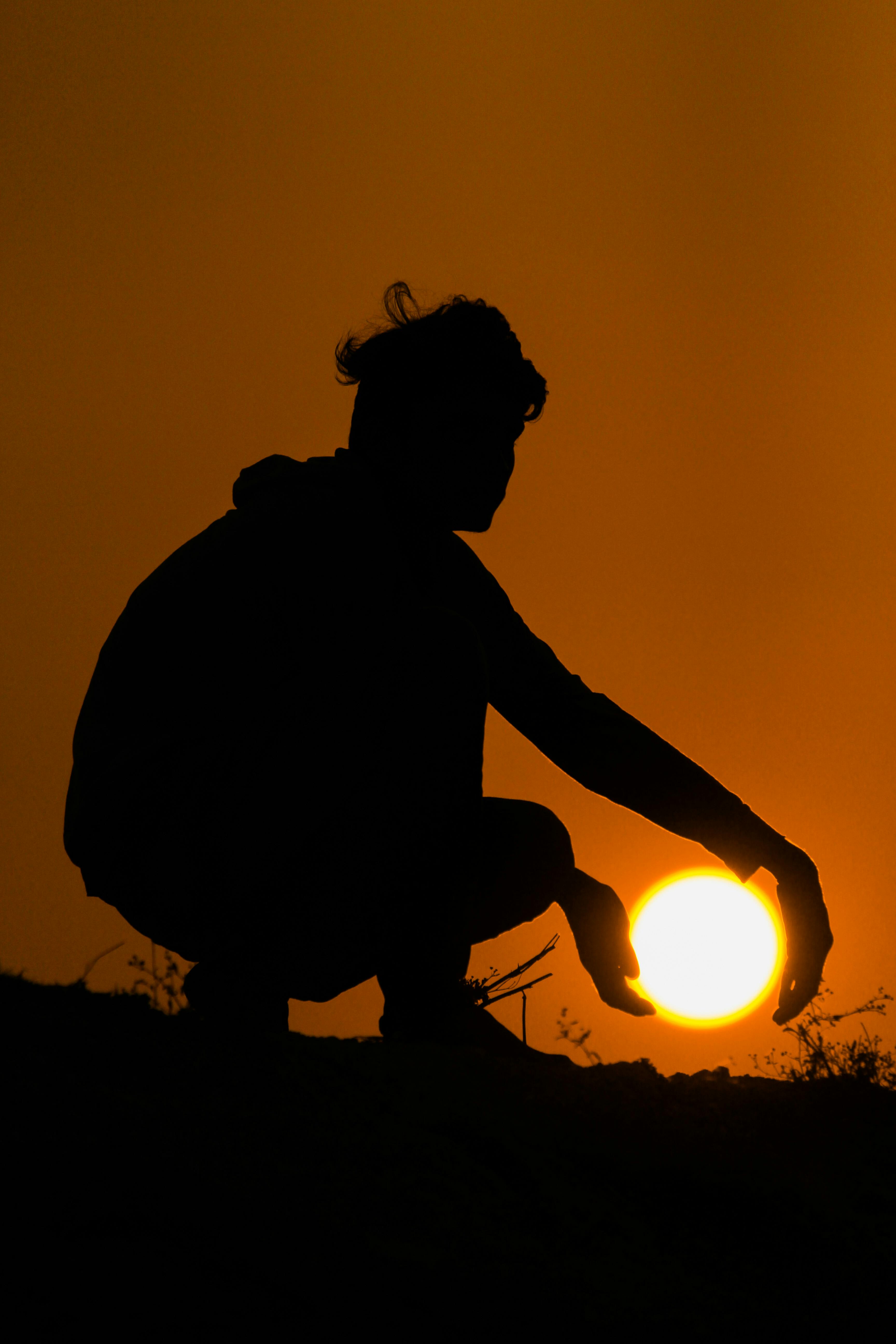 Silhouette of Woman Against Sunset · Free Stock Photo