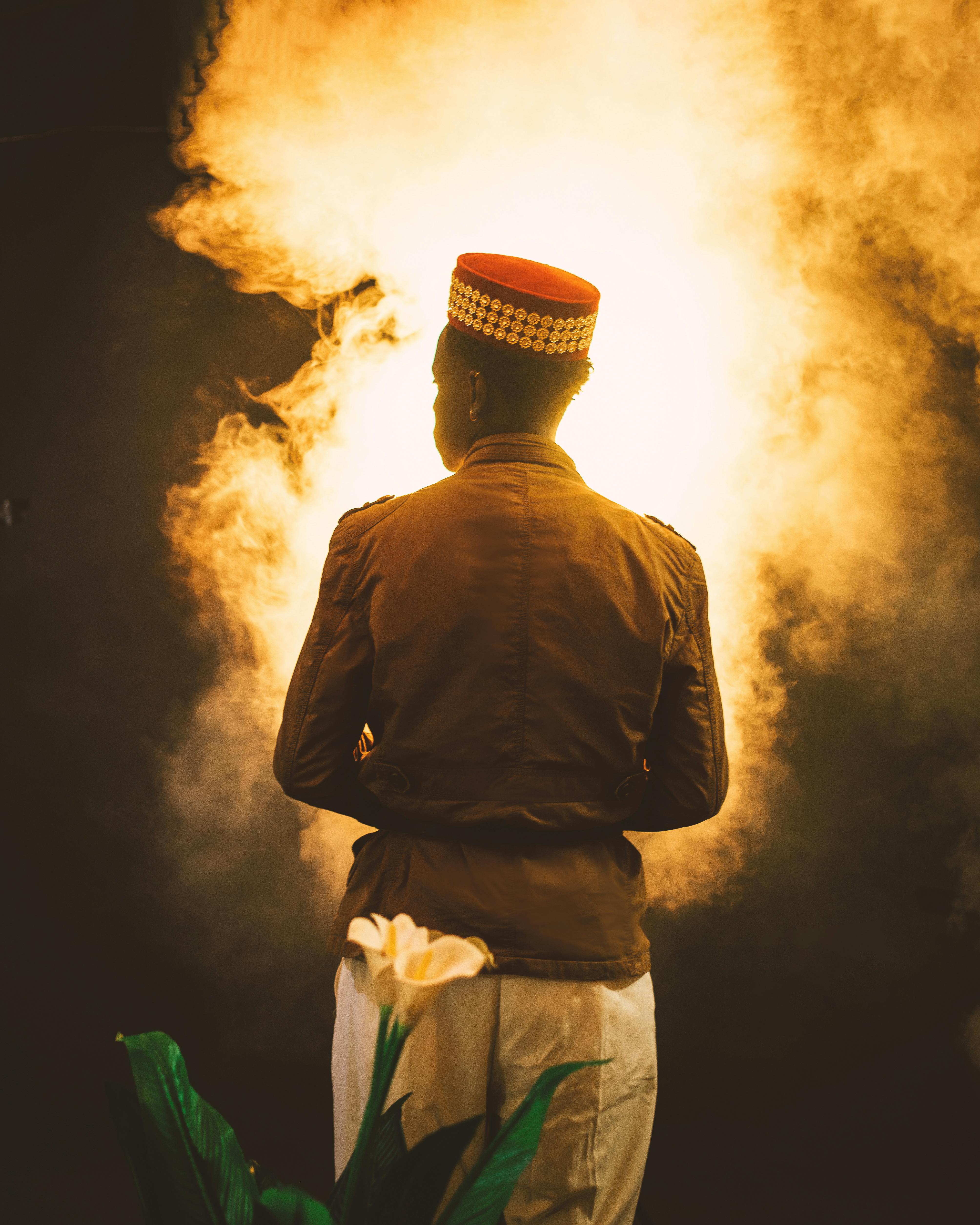 Back View of Man in Traditional Red Hat with Abstract Background · Free ...