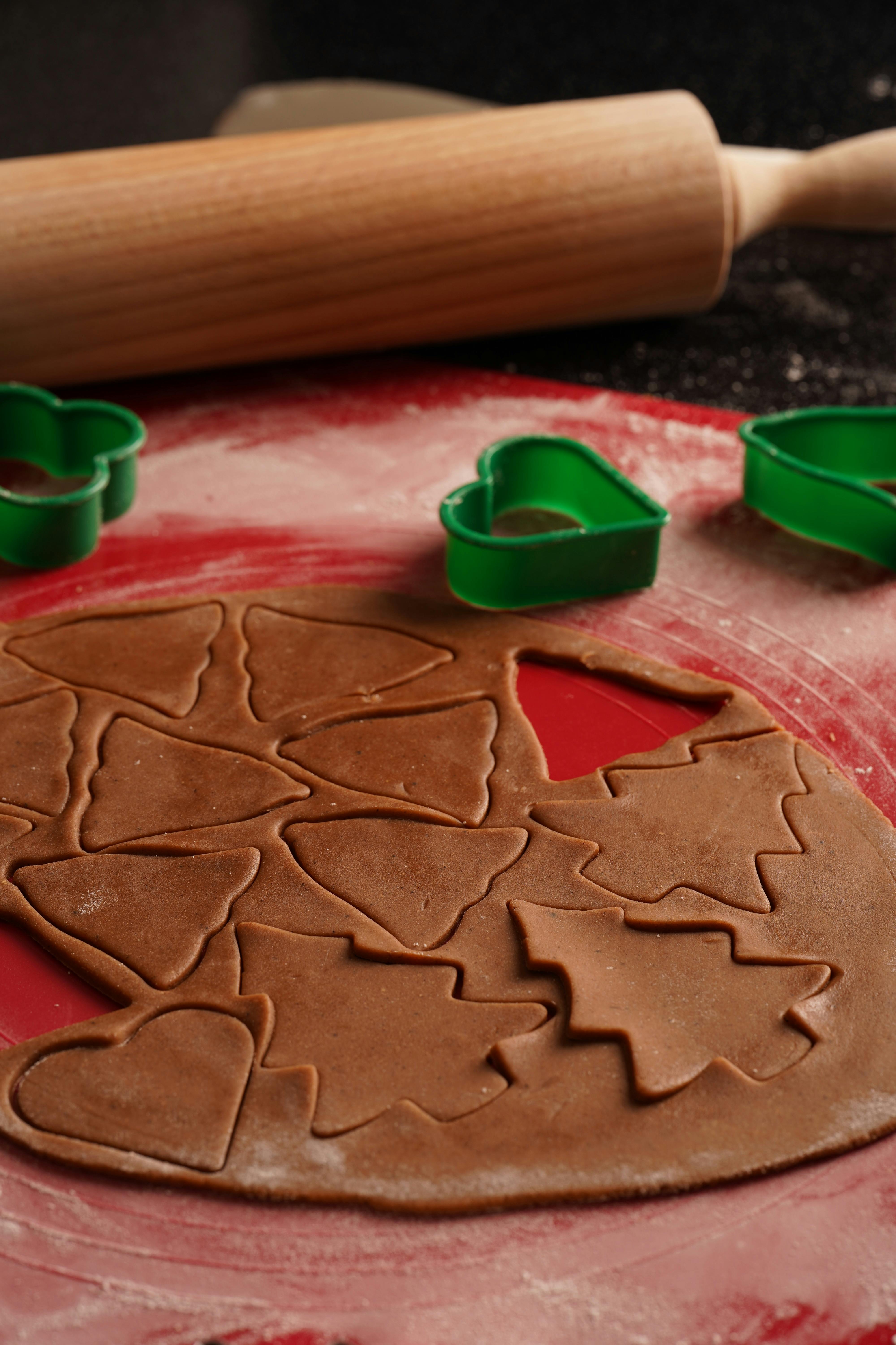 Christmas Cookie Cutouts on Dough · Free Stock Photo