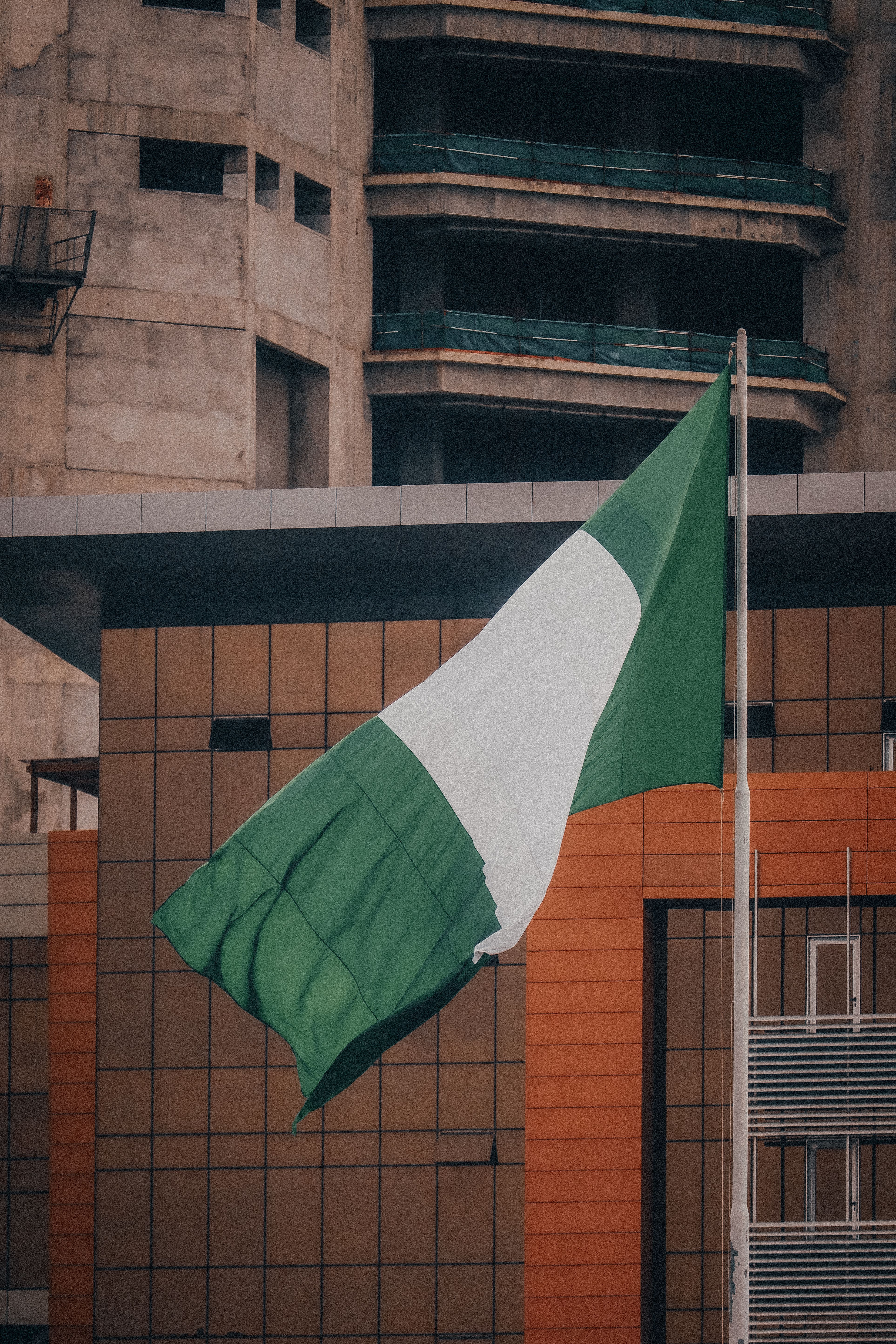 Nigerian Flag Waving in Urban Environment · Free Stock Photo
