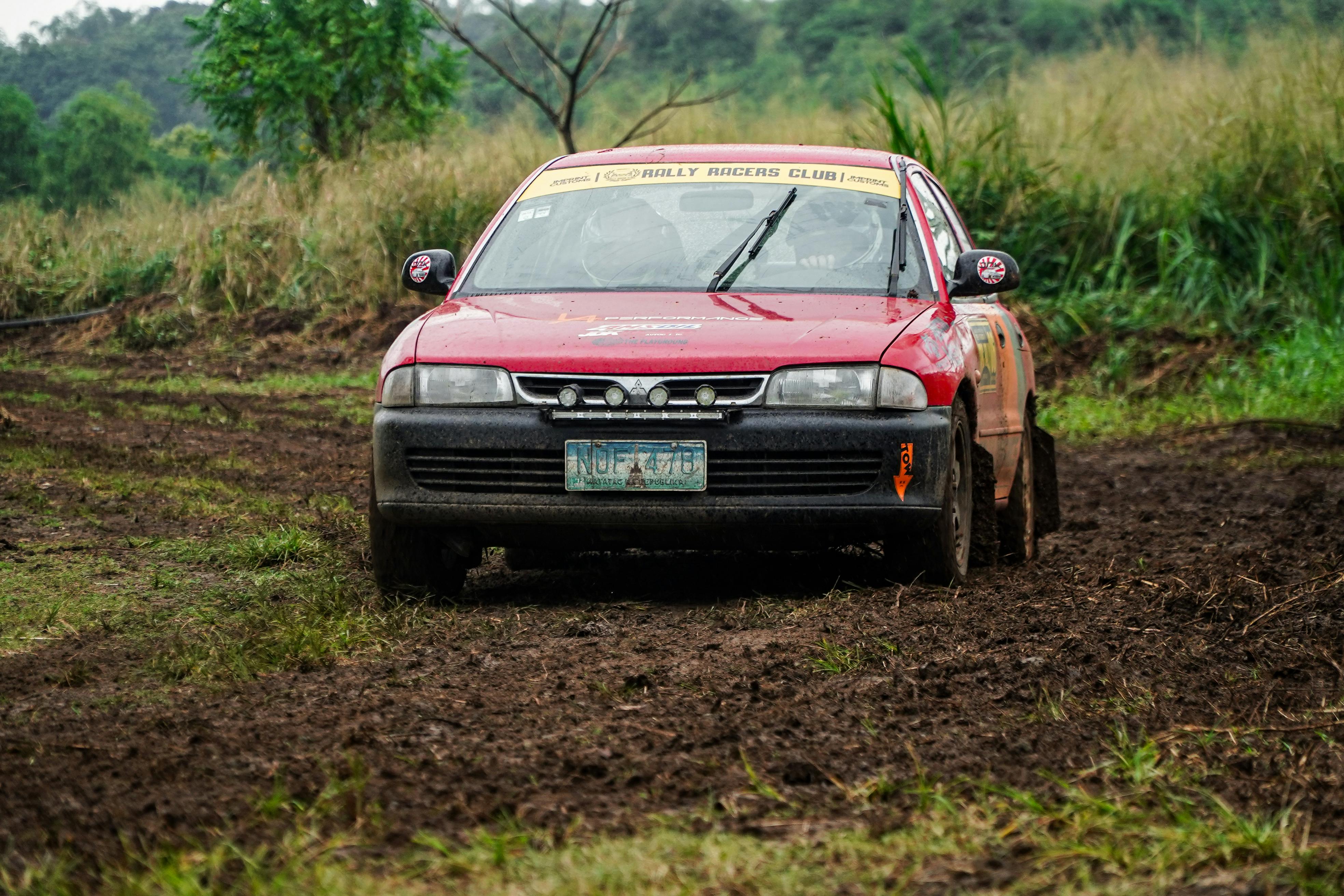 Red Rally Car Racing on Muddy Track · Free Stock Photo