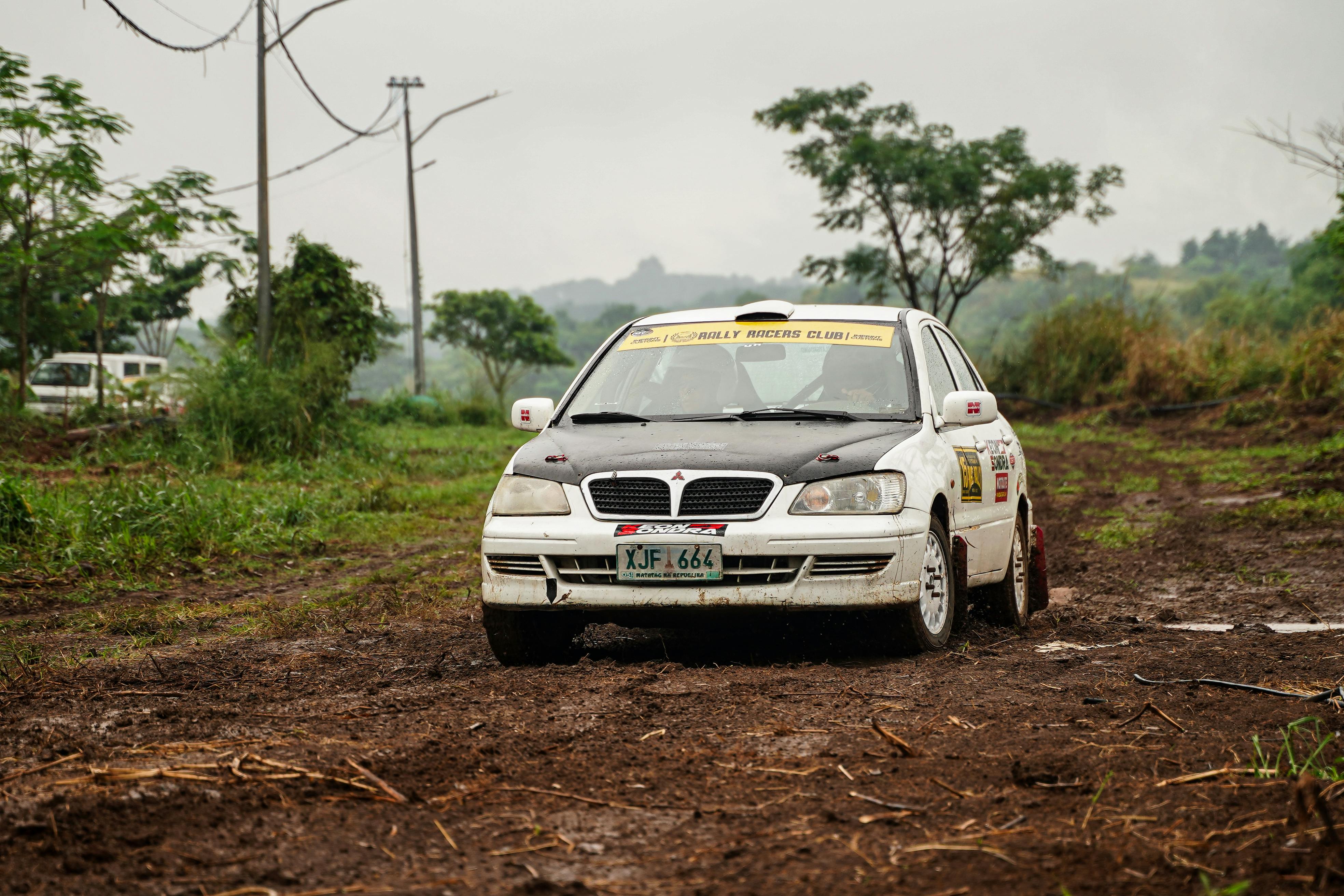 White Rally Car on Muddy Terrain in Philippines · Free Stock Photo