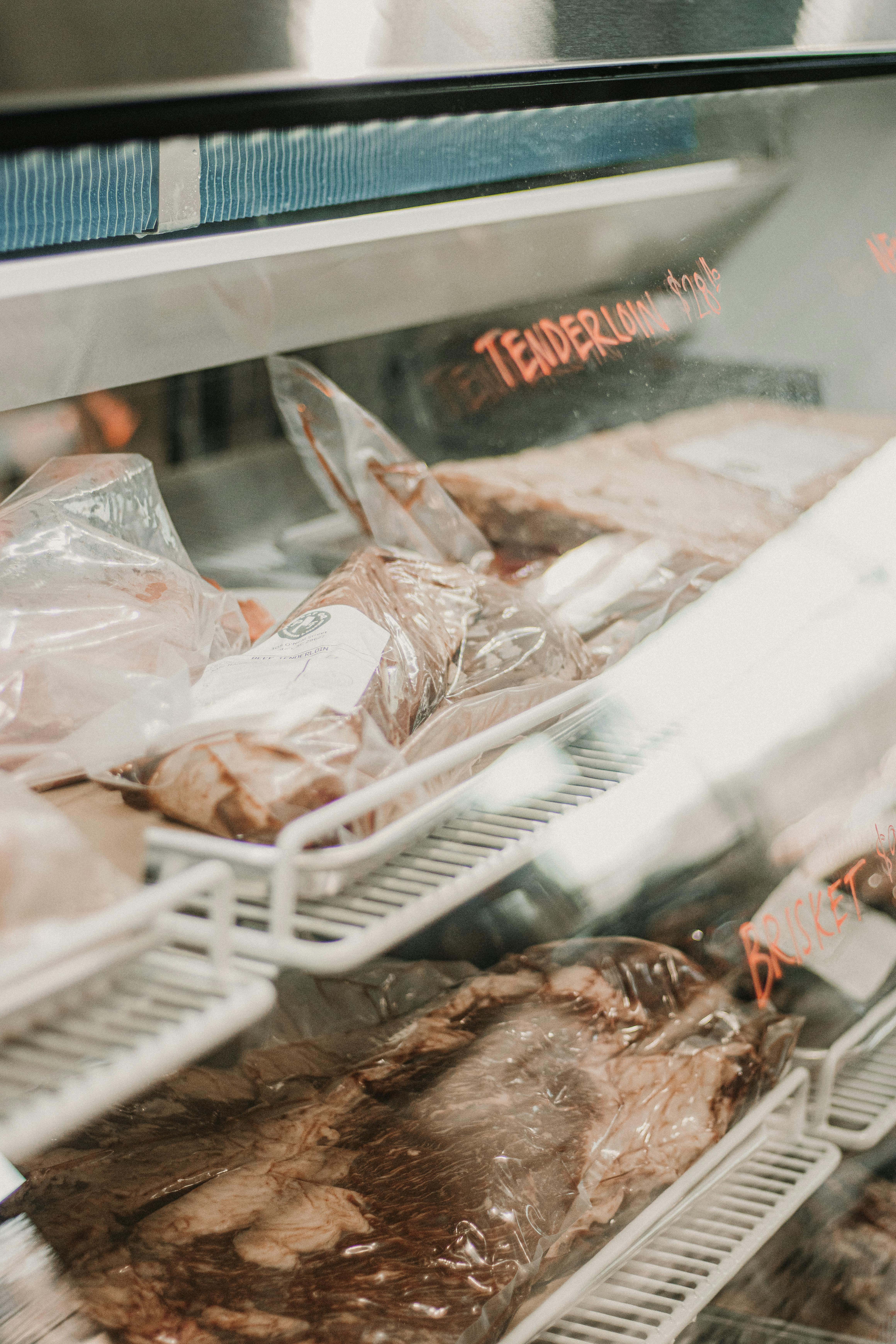 Fresh Cuts of Meat in Butcher Shop Display · Free Stock Photo