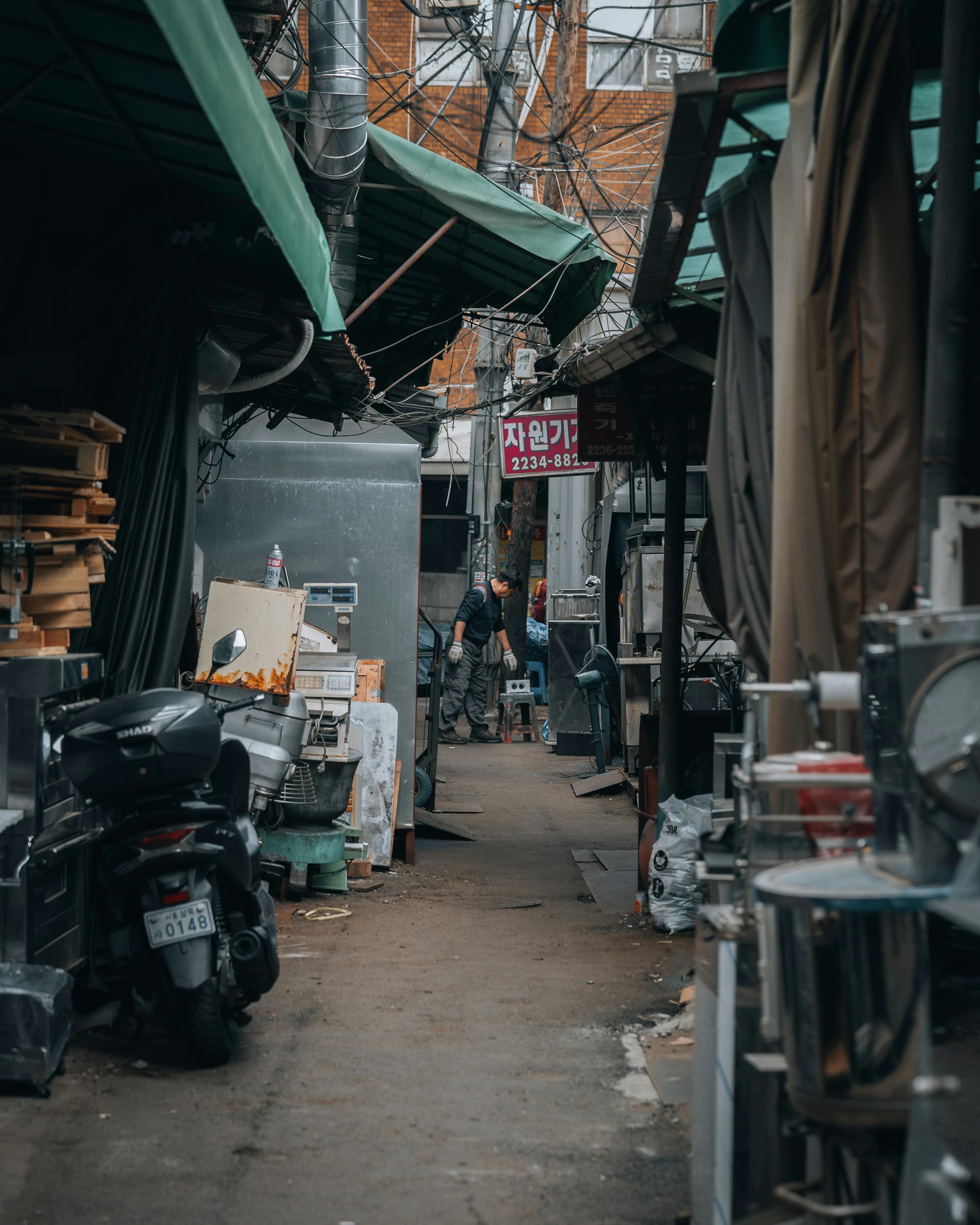Seoul Market Alleyway Scene with Motorbike · Free Stock Photo