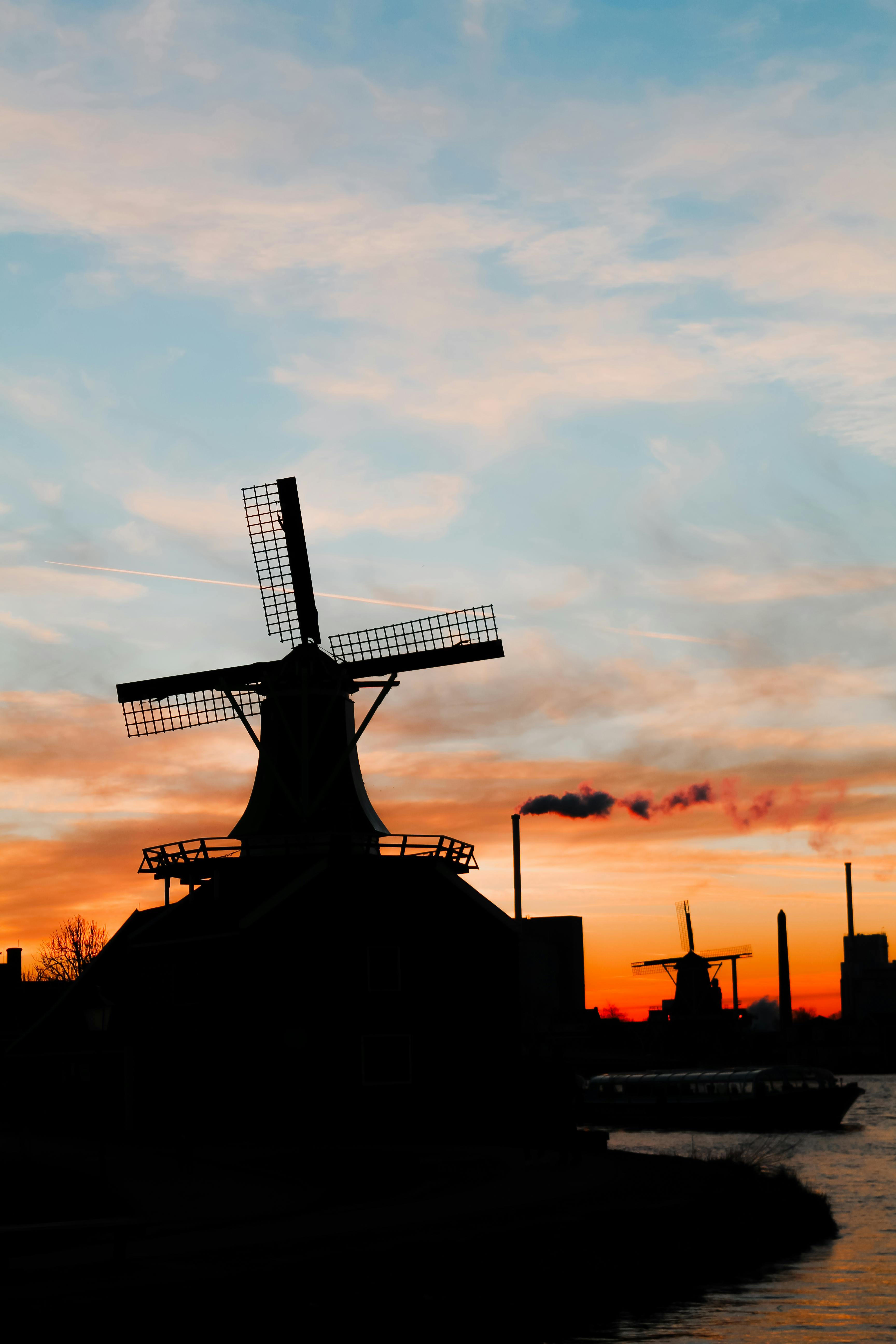 Iconic Dutch Windmill at Sunset in Amsterdam · Free Stock Photo