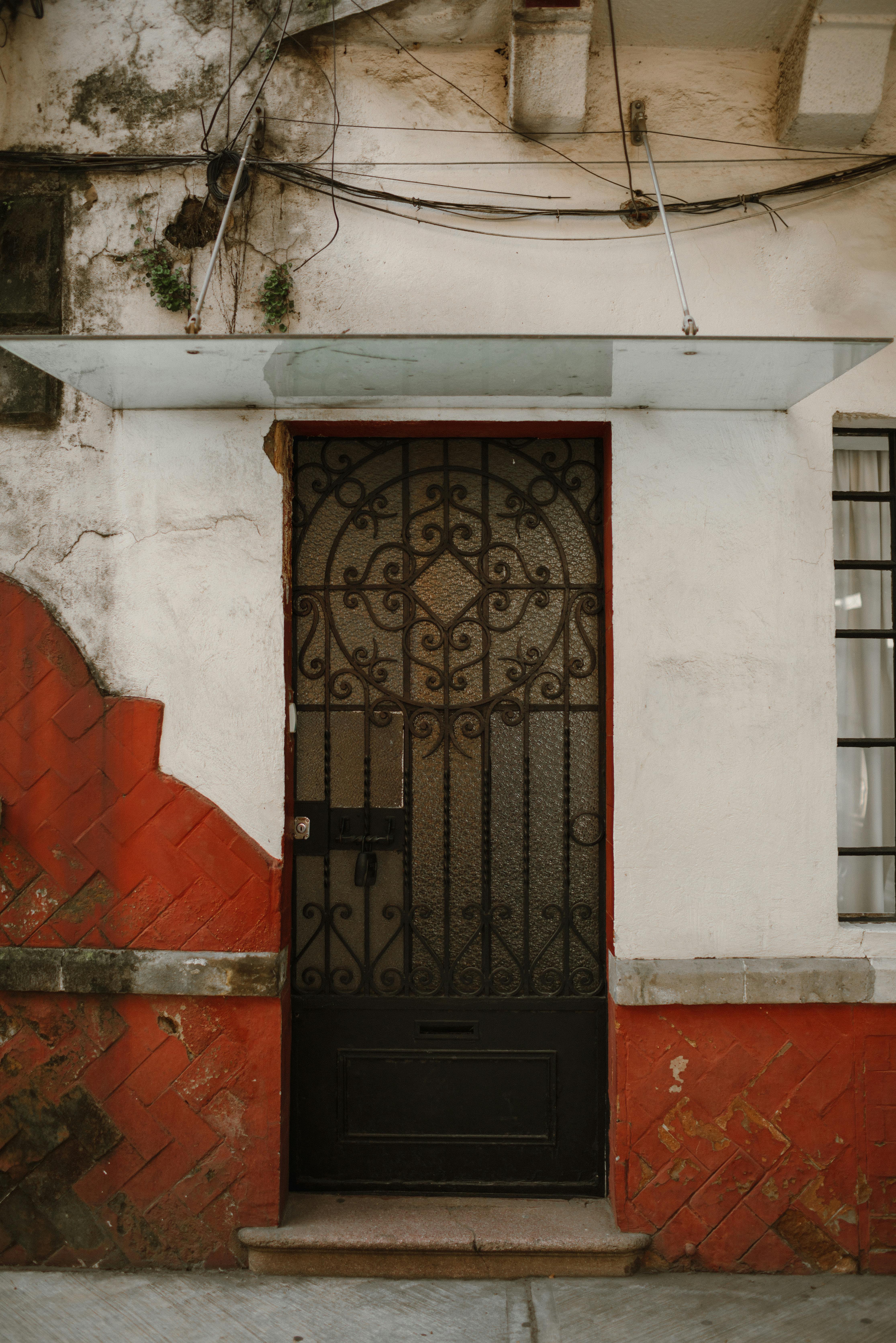 Rustic Iron Door in Vintage Building Exterior · Free Stock Photo