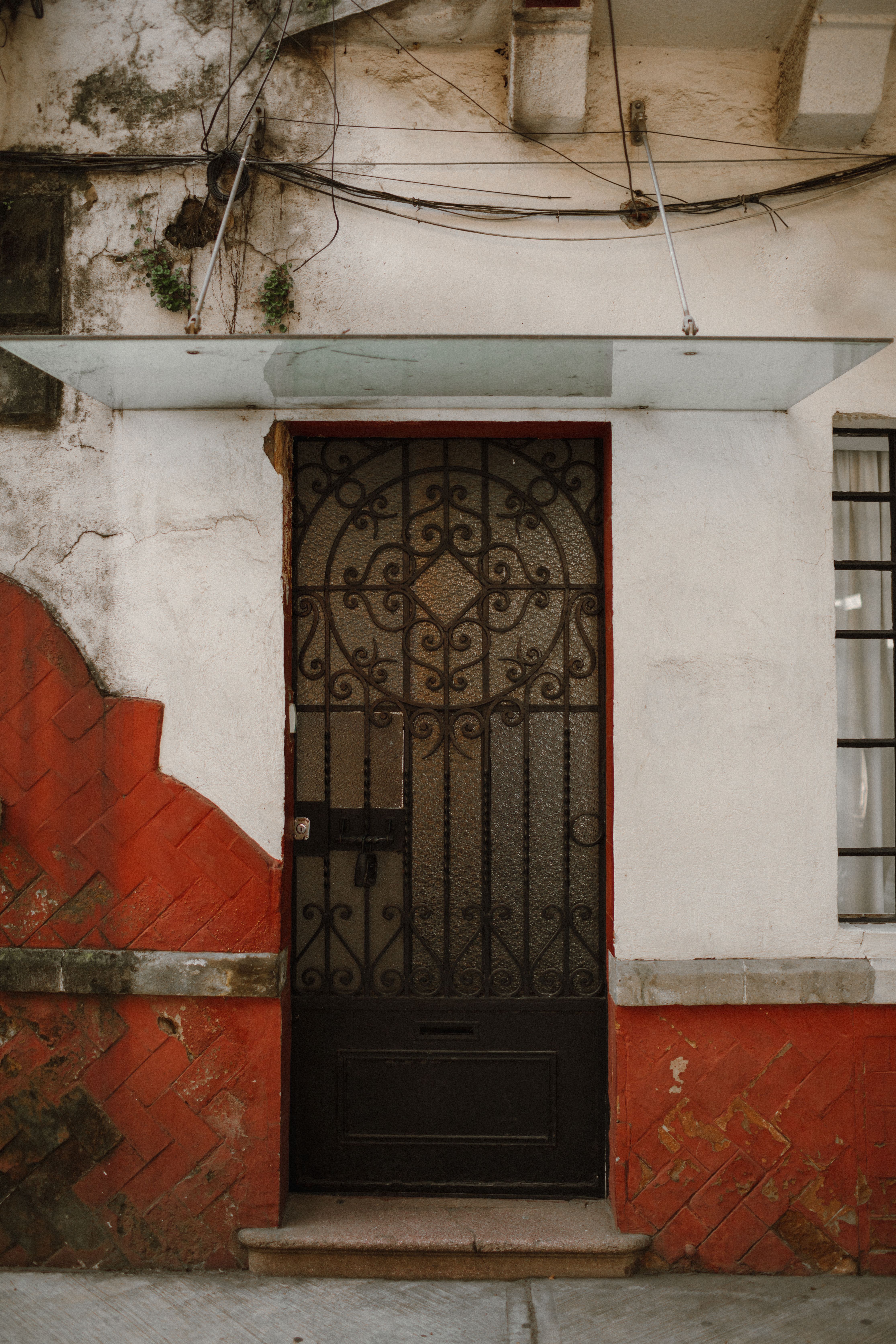 Rustic Iron Door in Vintage Building Exterior · Free Stock Photo