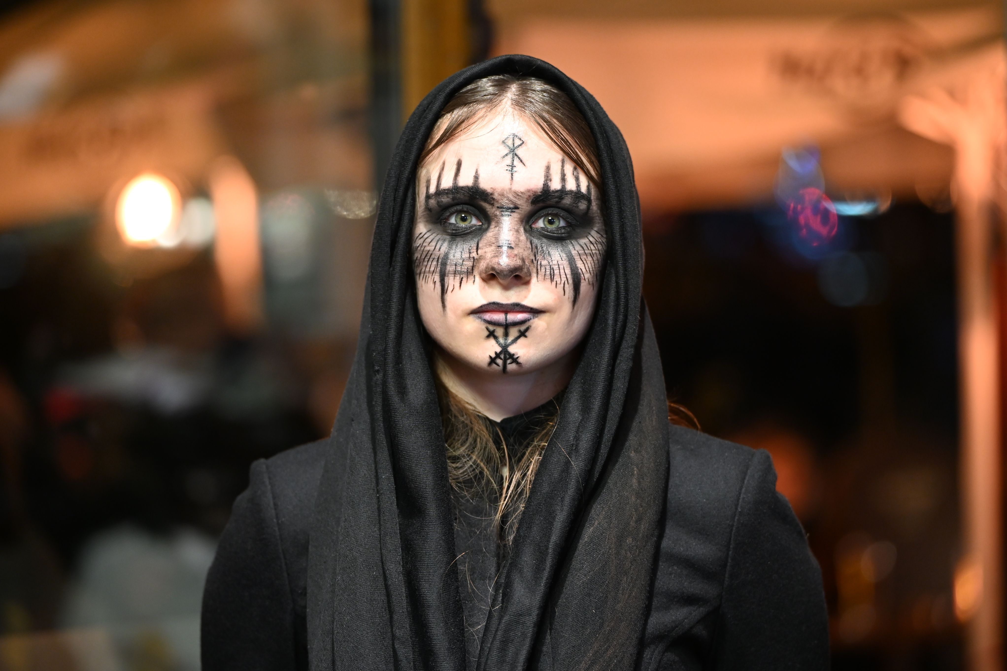 Mysterious Woman with Gothic Face Paint on Street · Free Stock Photo