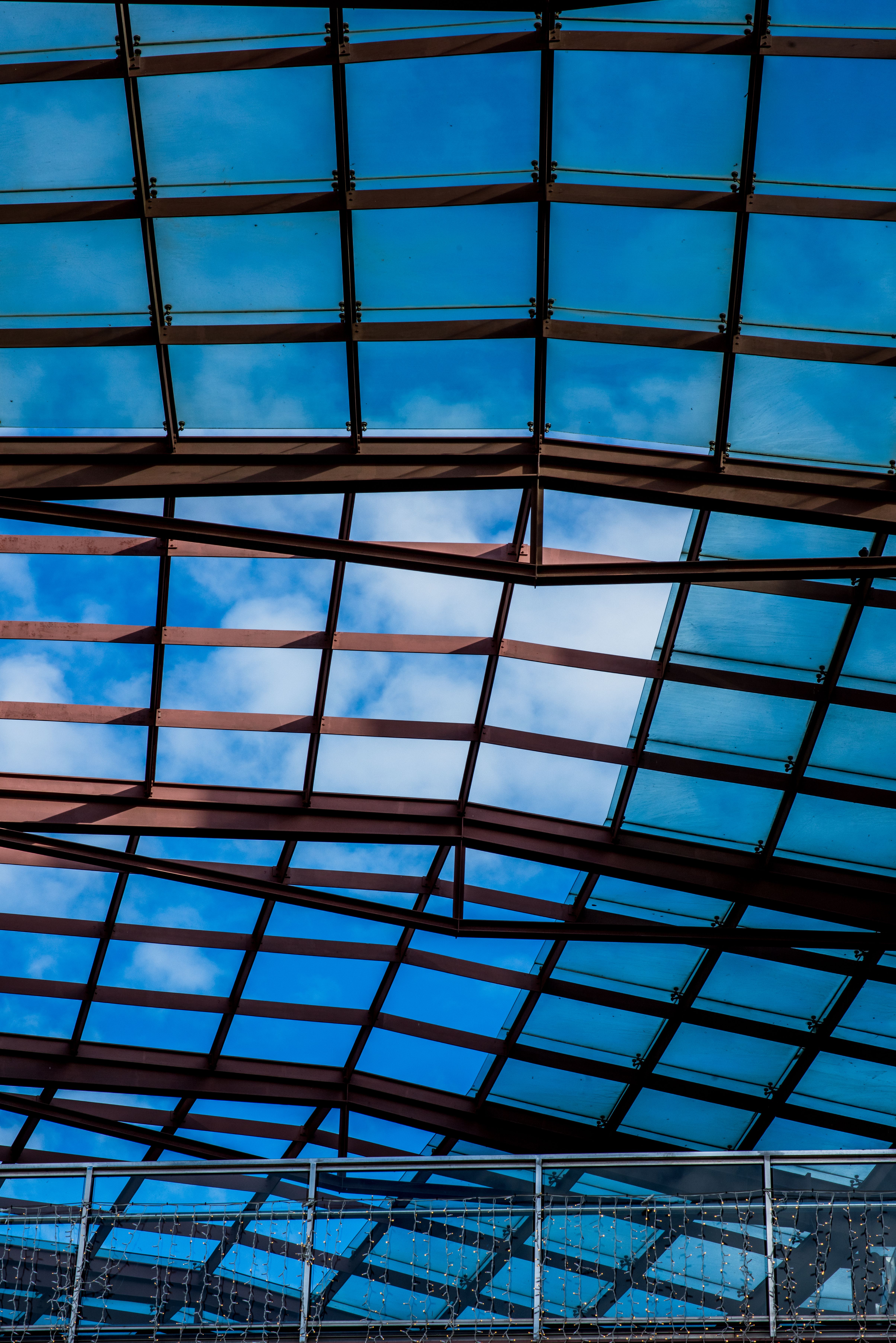 Modern Glass Roof with Steel Structure Highlighting Sky · Free Stock Photo