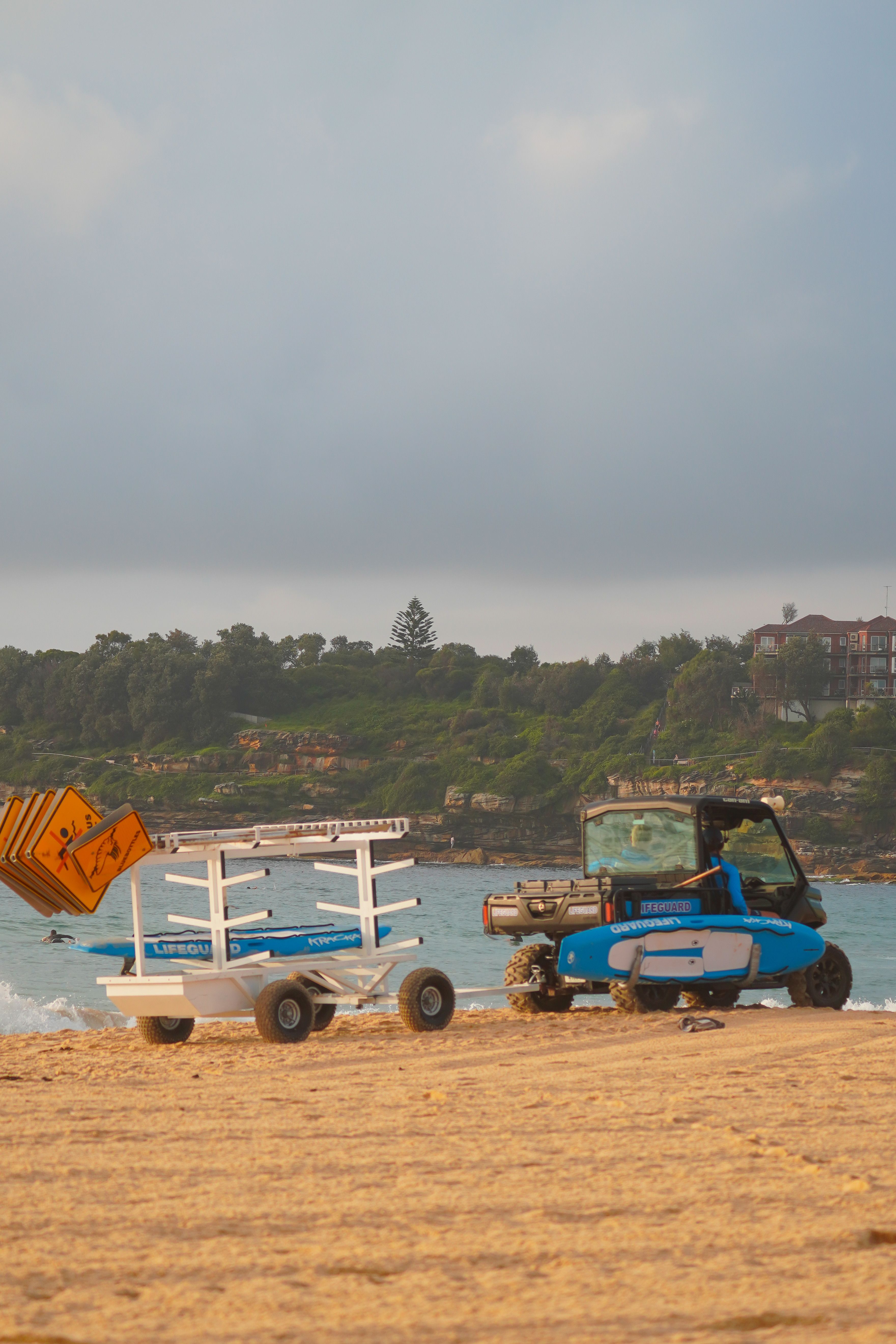 Beach Cleaning Tractor on Sandy Shoreline · Free Stock Photo