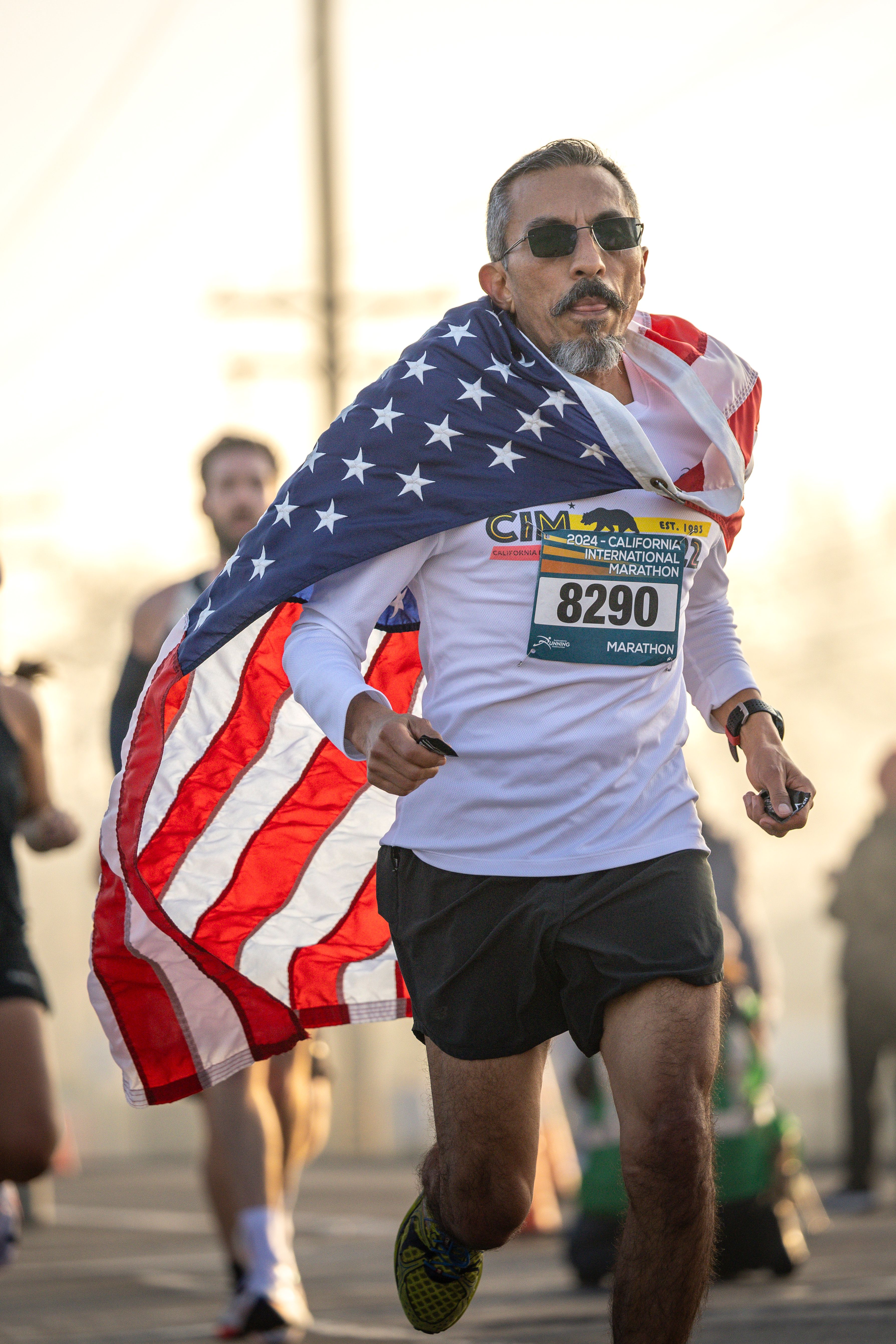 Man Running in Marathon with American Flag · Free Stock Photo