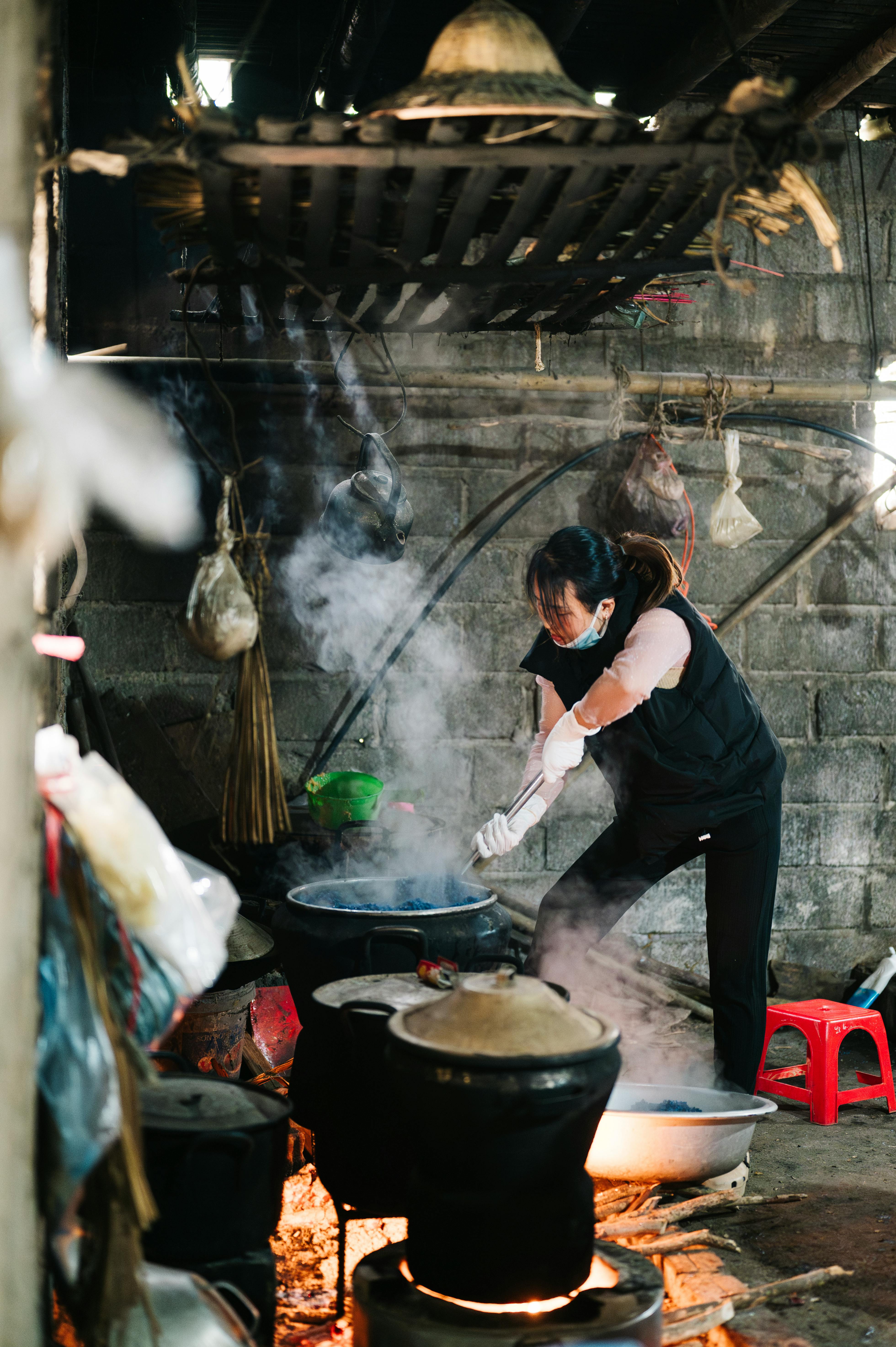 Traditional Vietnamese Cooking in Rustic Kitchen · Free Stock Photo