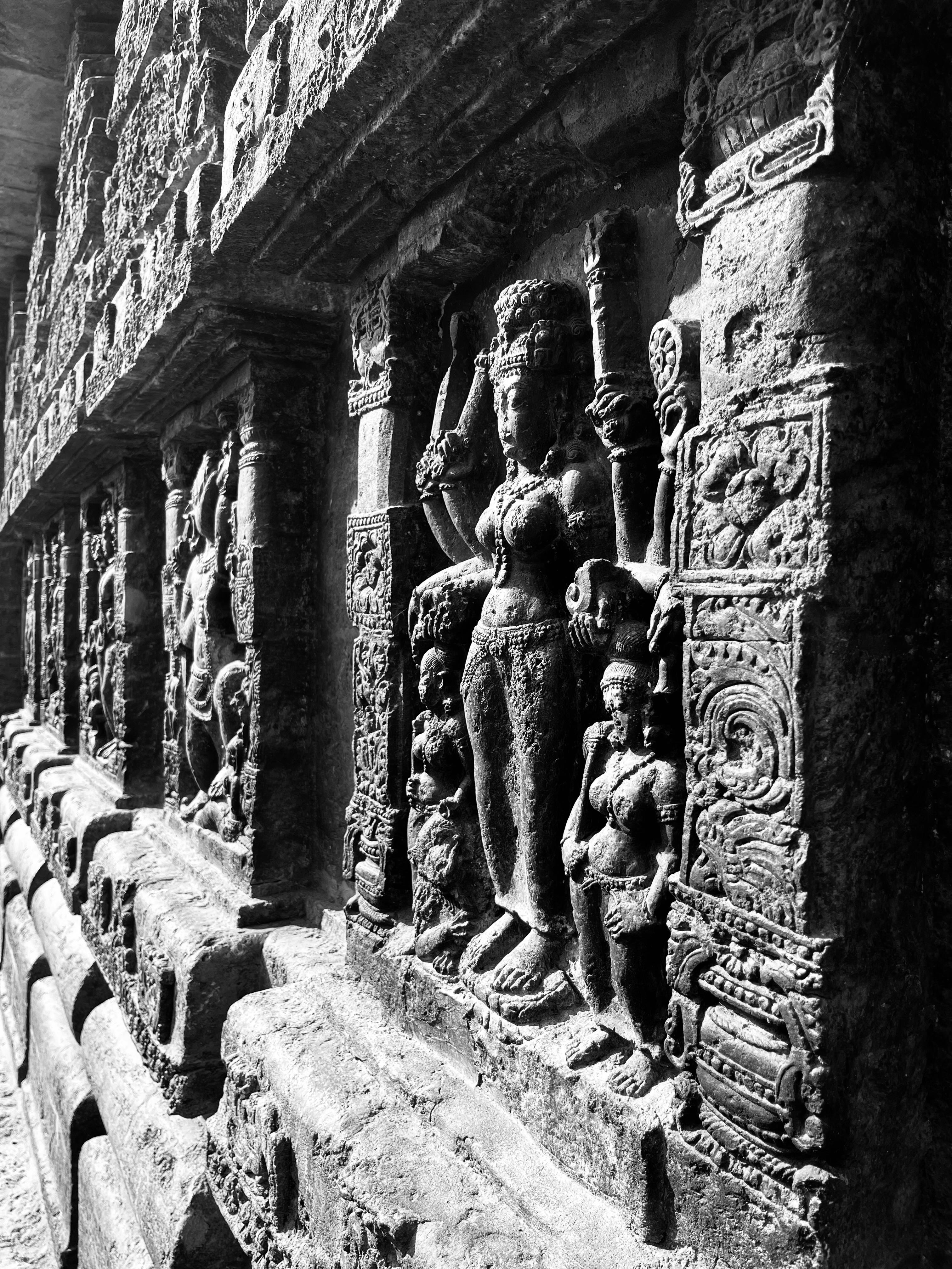 Detailed Stone Carvings on Ancient Temple Wall · Free Stock Photo