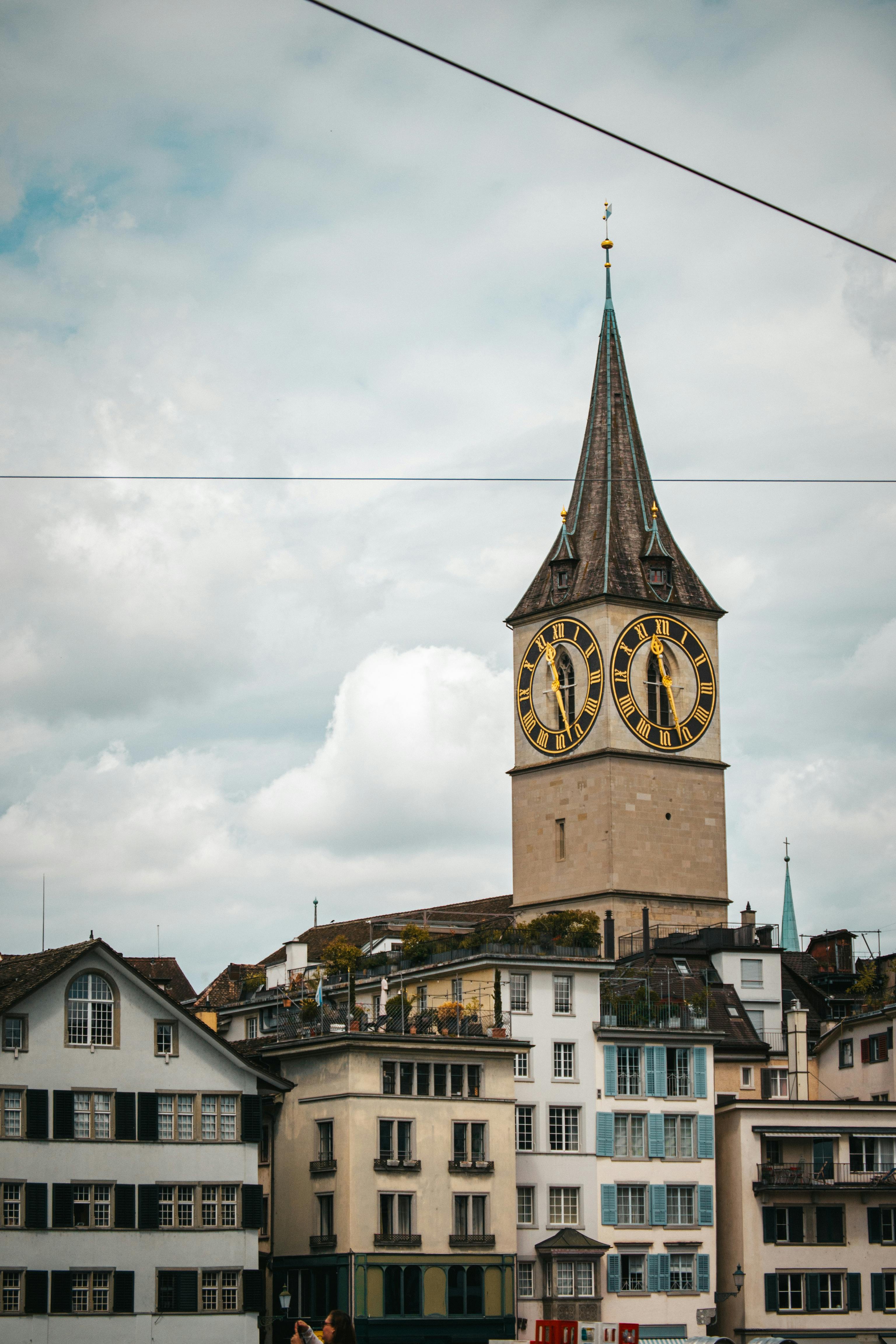 Historic Clock Tower in Zurich Cityscape · Free Stock Photo