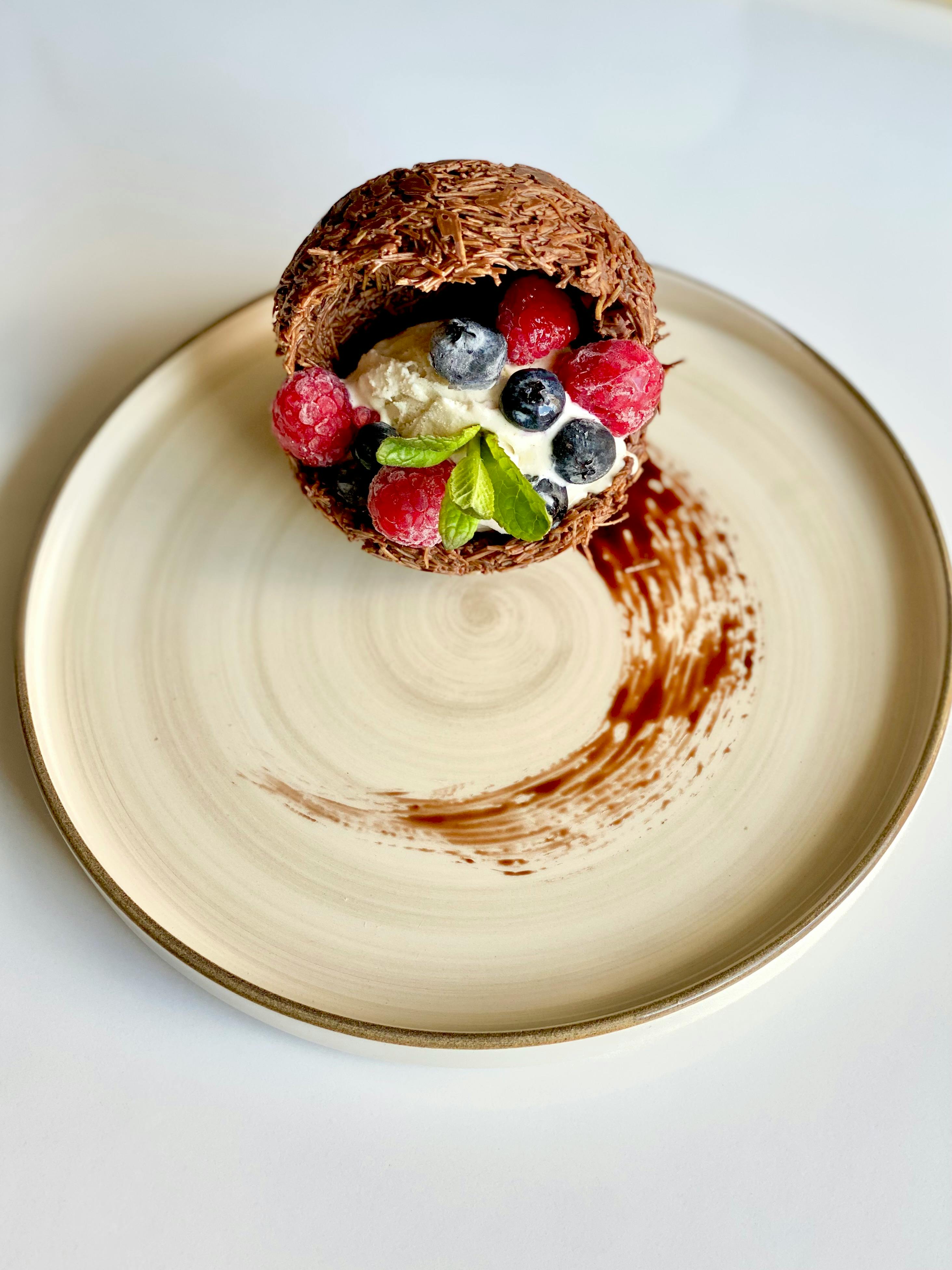 Gourmet Dessert with Berries and Chocolate Sphere · Free Stock Photo