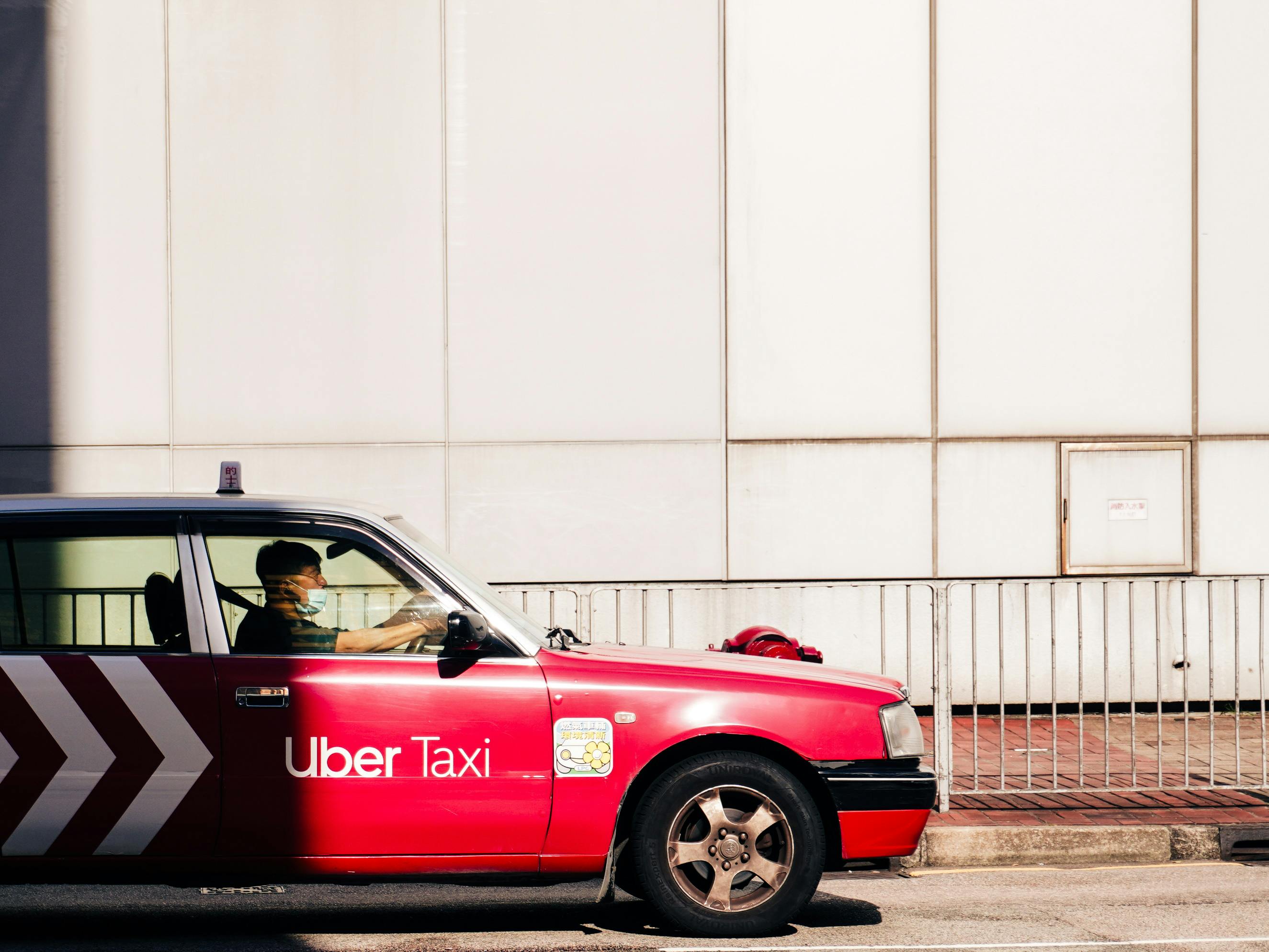 Red Taxi in Hong Kong Sunlight · Free Stock Photo