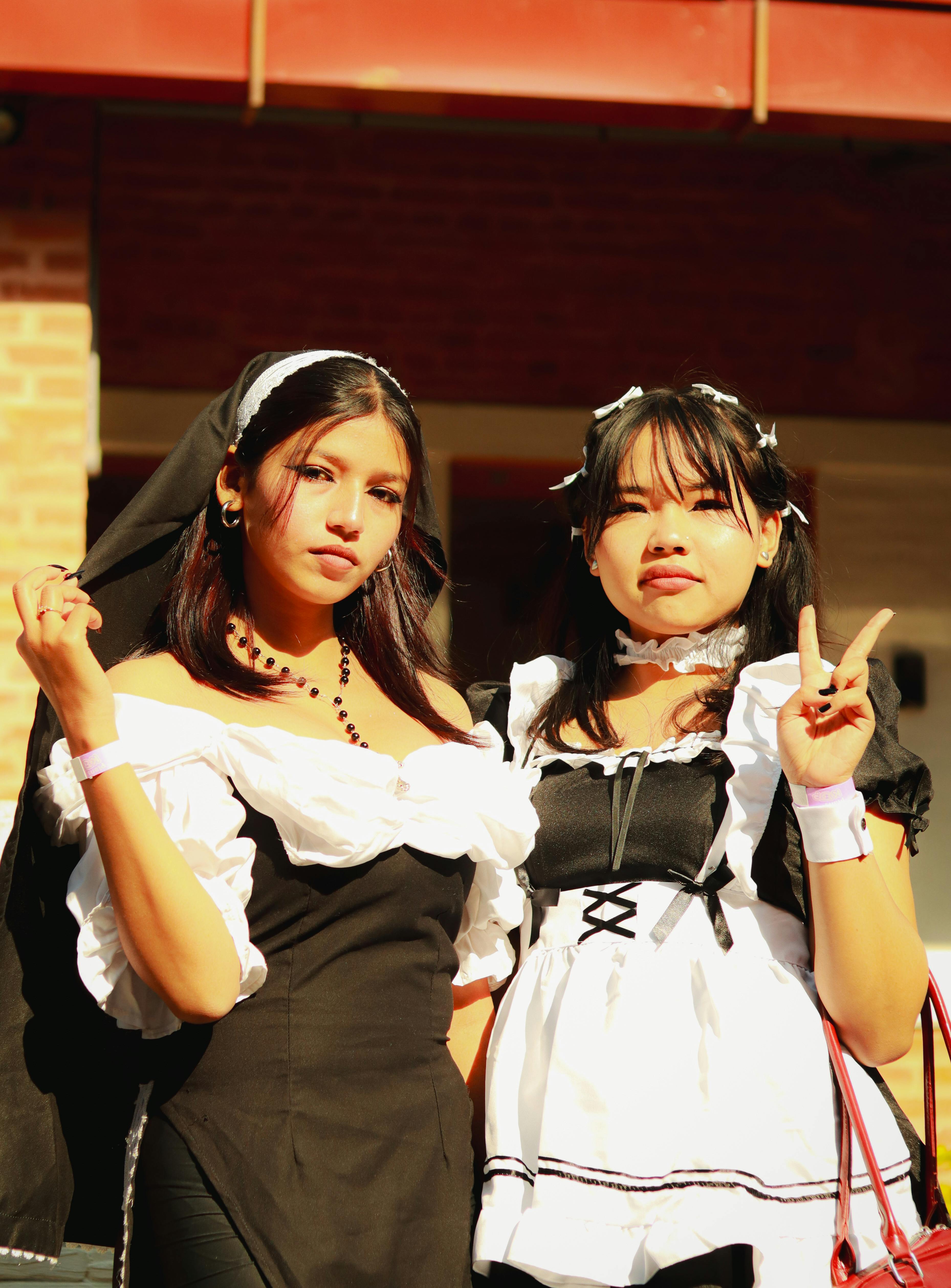 Stylish Duo in Gothic Fashion Outdoors · Free Stock Photo