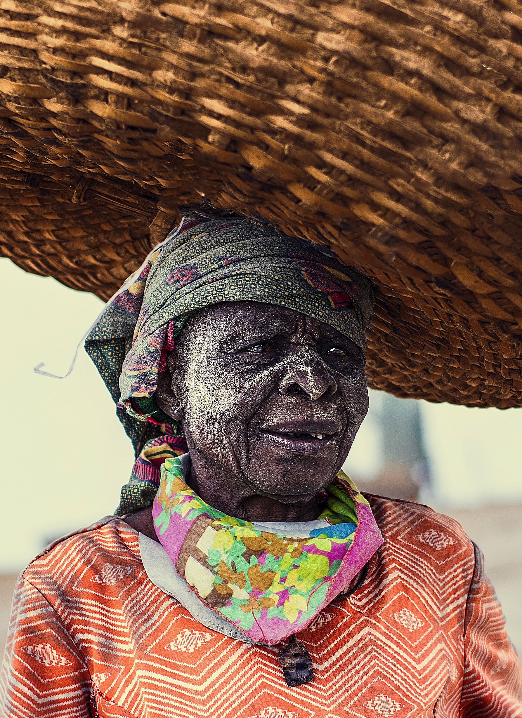 Elderly Woman Carrying Woven Basket Outdoors · Free Stock Photo