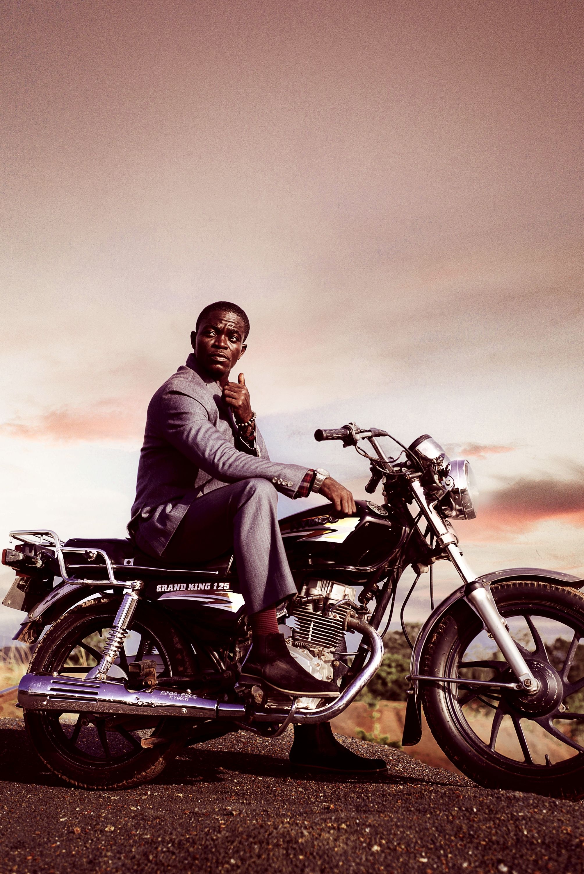 Stylish Man Posing on Motorcycle at Sunset · Free Stock Photo