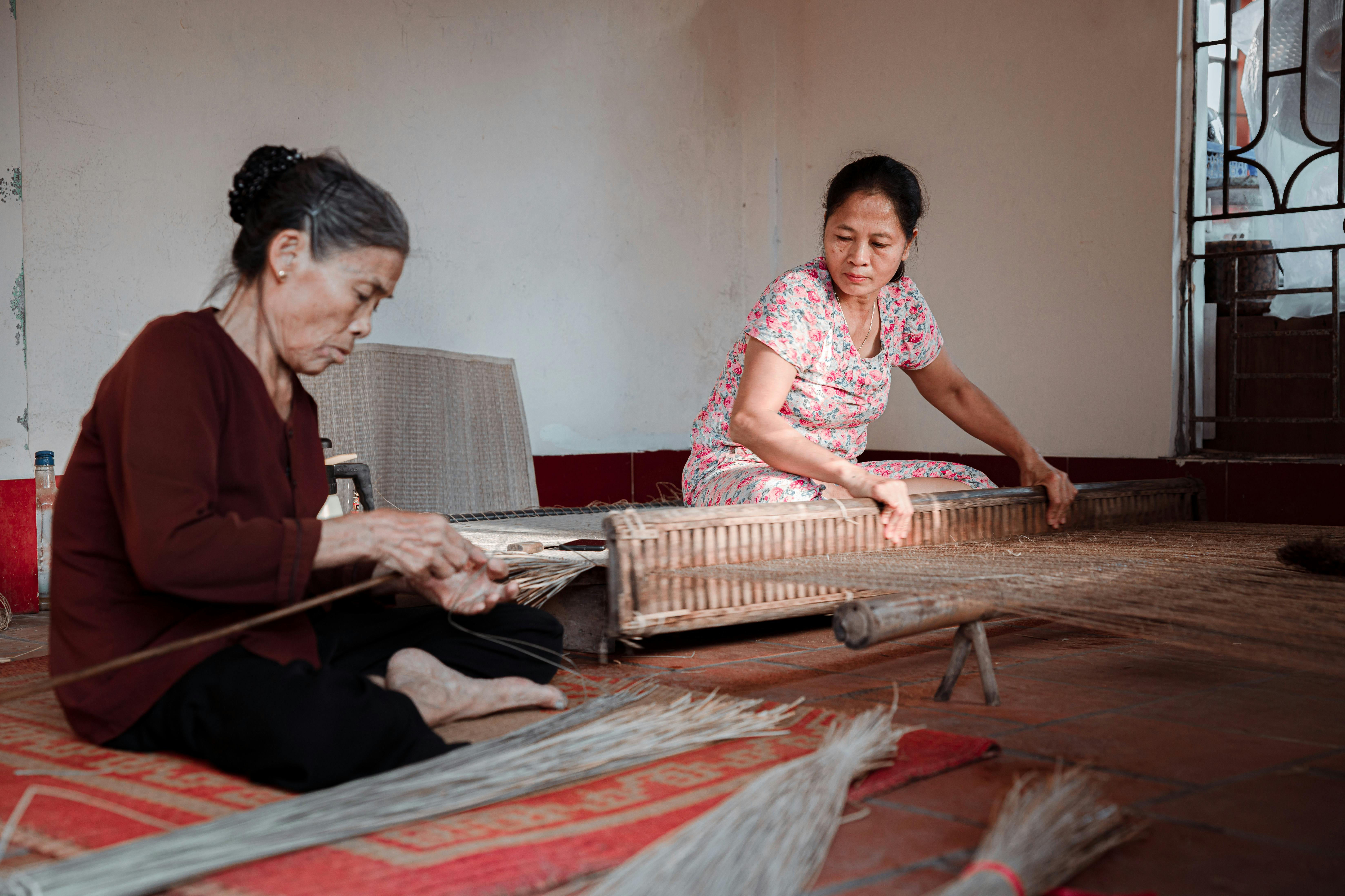 Asian Women Crafting Traditional Basket Indoors · Free Stock Photo