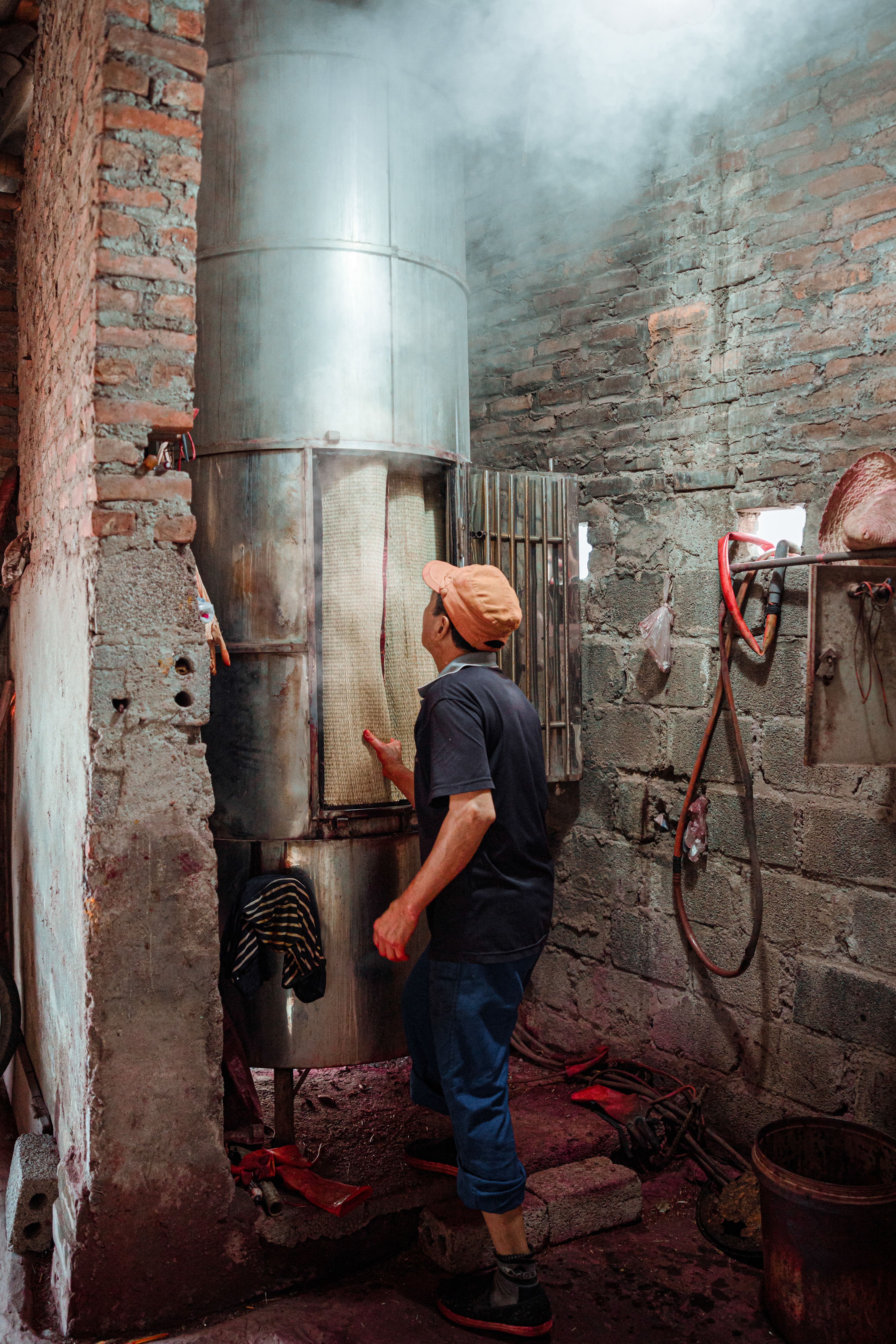 Worker Operating Industrial Metal Furnace Indoors · Free Stock Photo