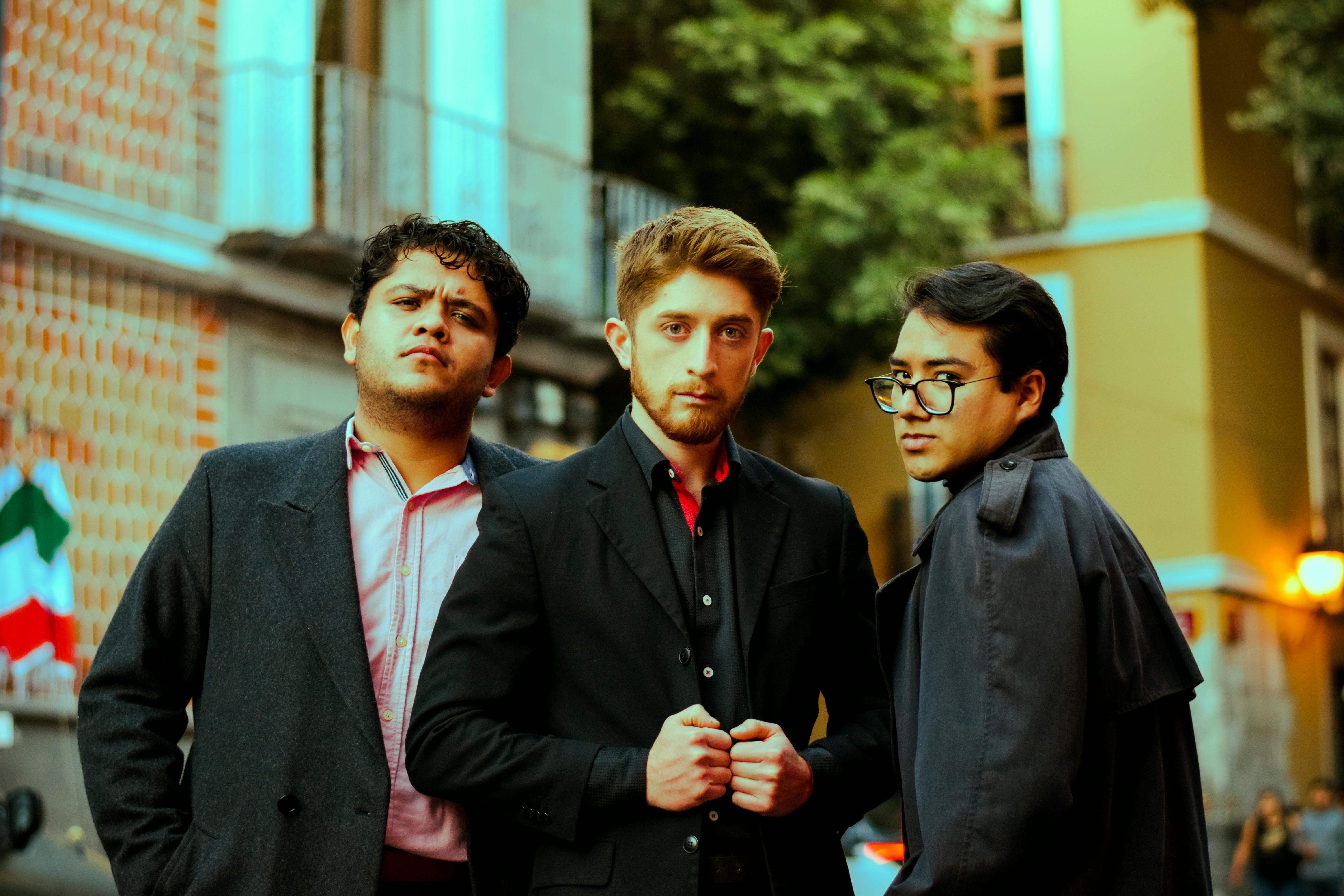 Stylish Group of Men Posing Outdoors · Free Stock Photo