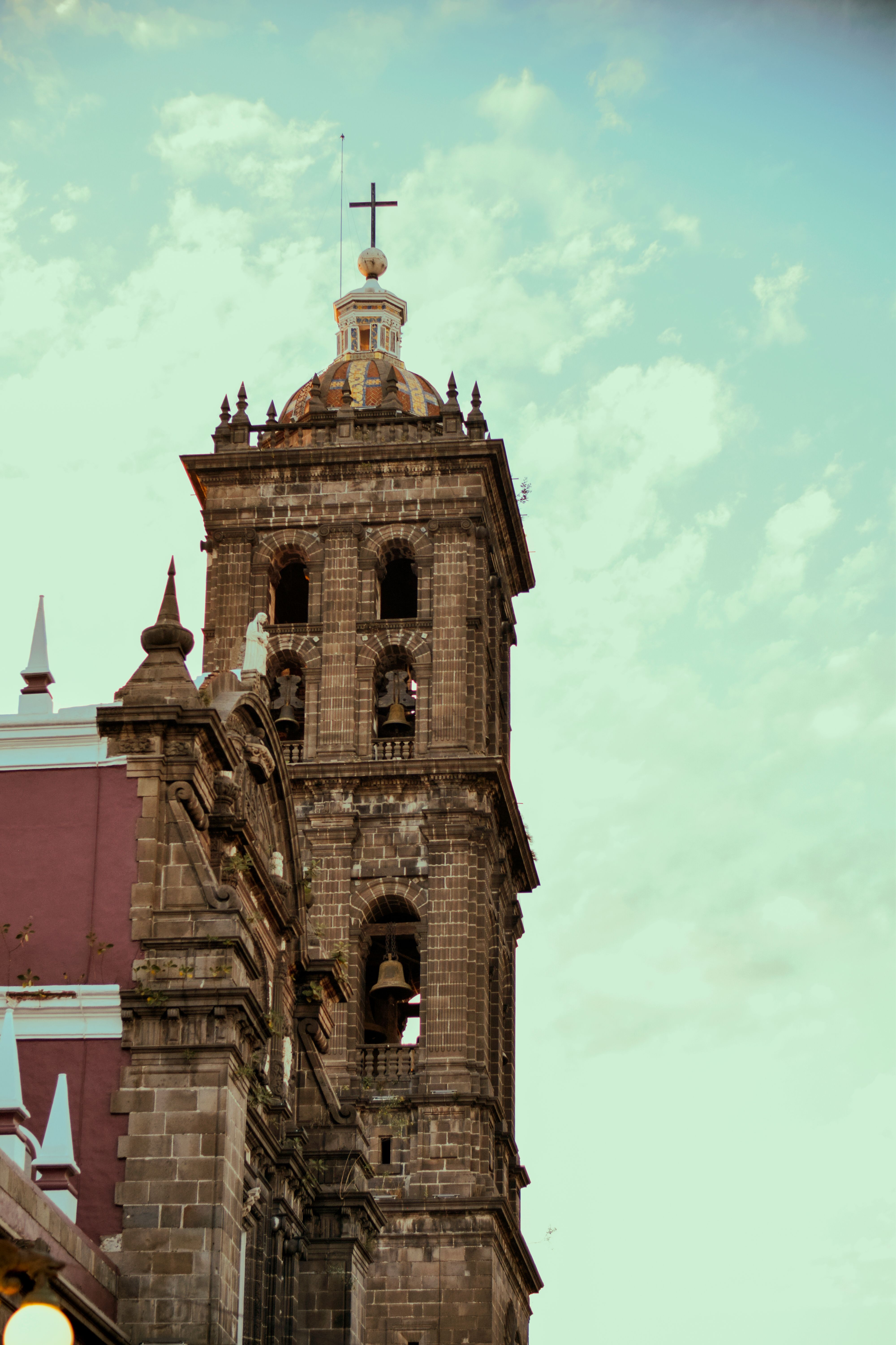 Historic Church Bell Tower Against Blue Sky · Free Stock Photo