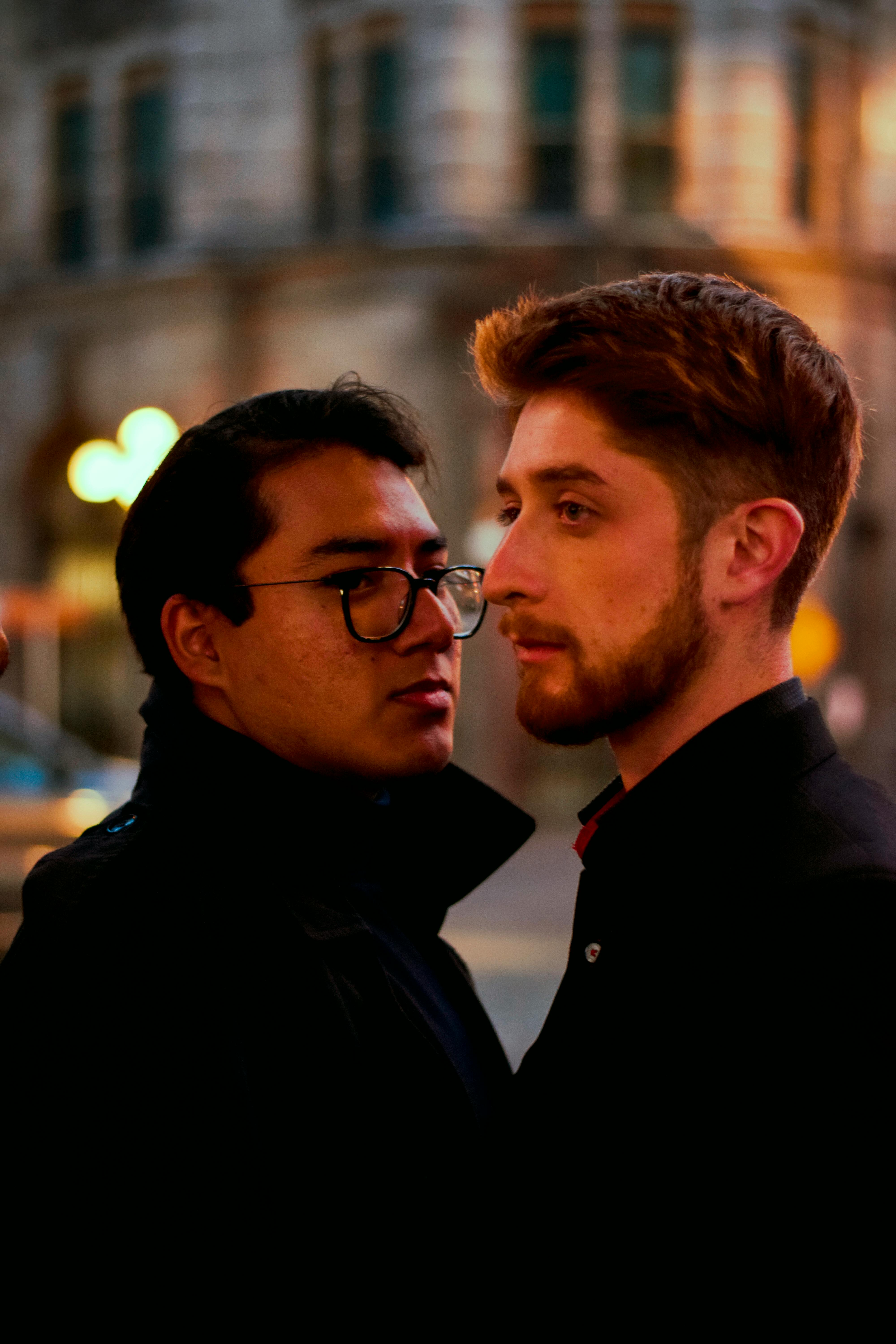 Expression of Intimacy Between Two Men at Dusk · Free Stock Photo