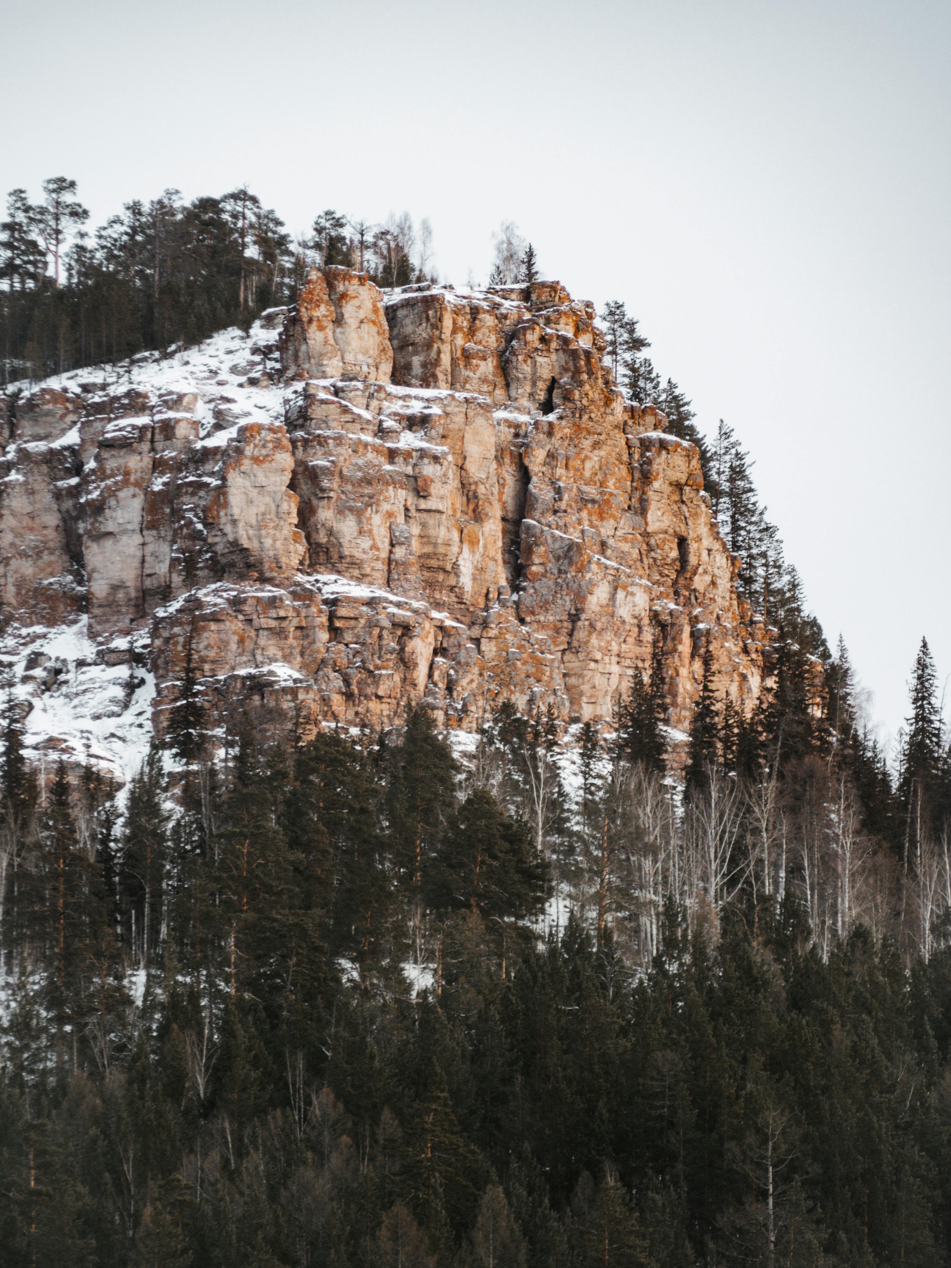 Snow-Covered Rocky Cliff in Irkutsk, Russia · Free Stock Photo