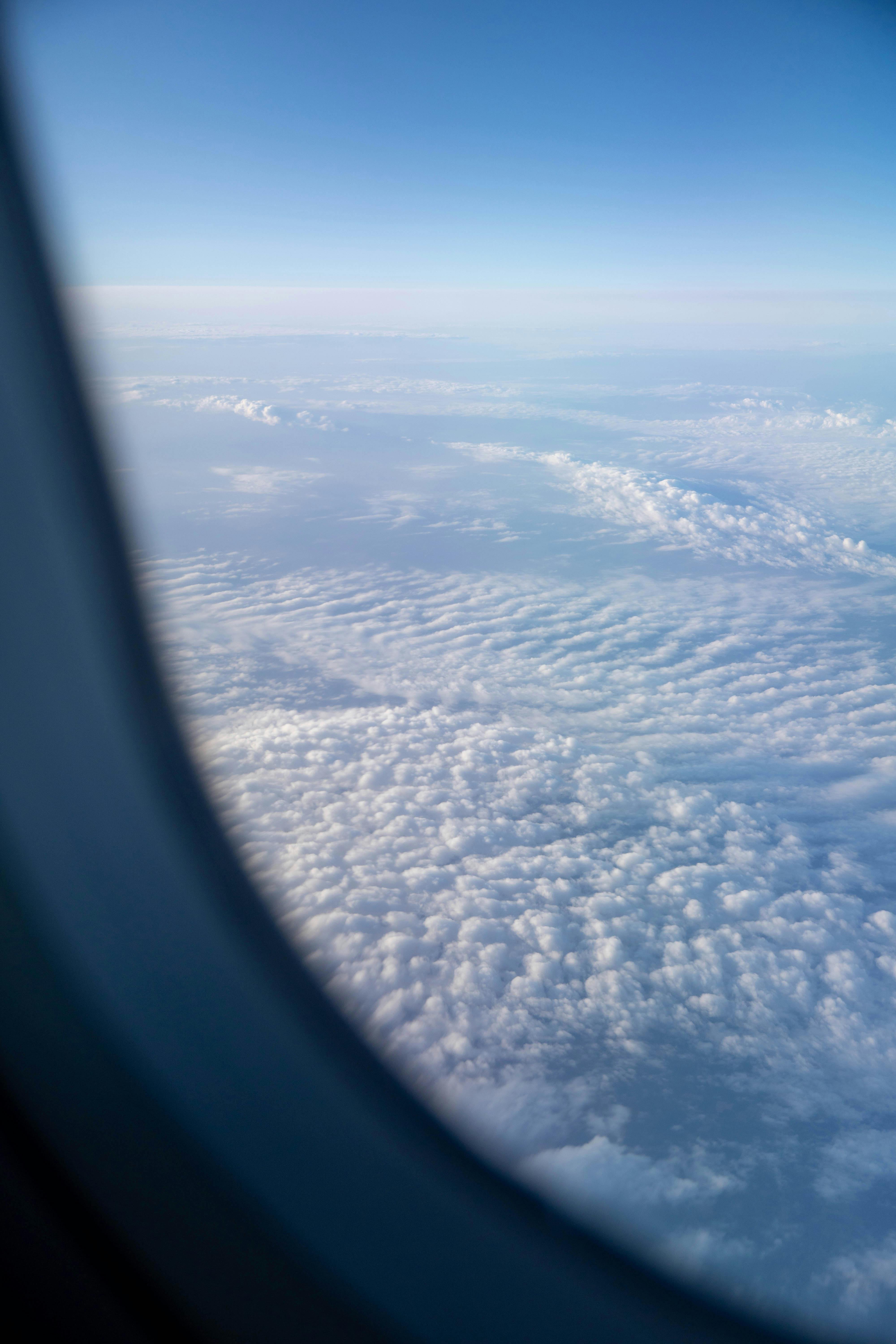 Aerial View of Clouds from Airplane Window · Free Stock Photo