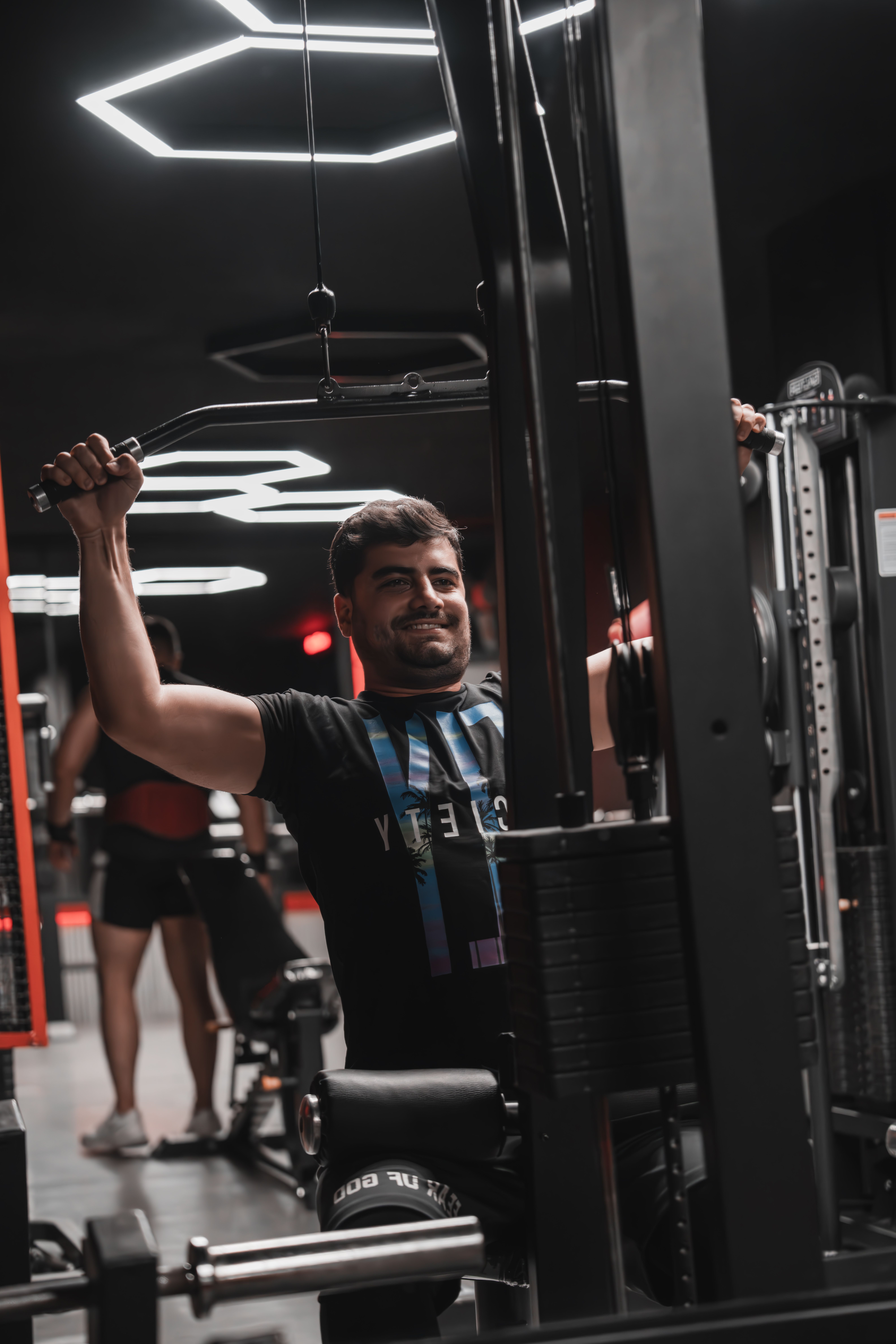 Man Working Out in Modern Gym Environment · Free Stock Photo