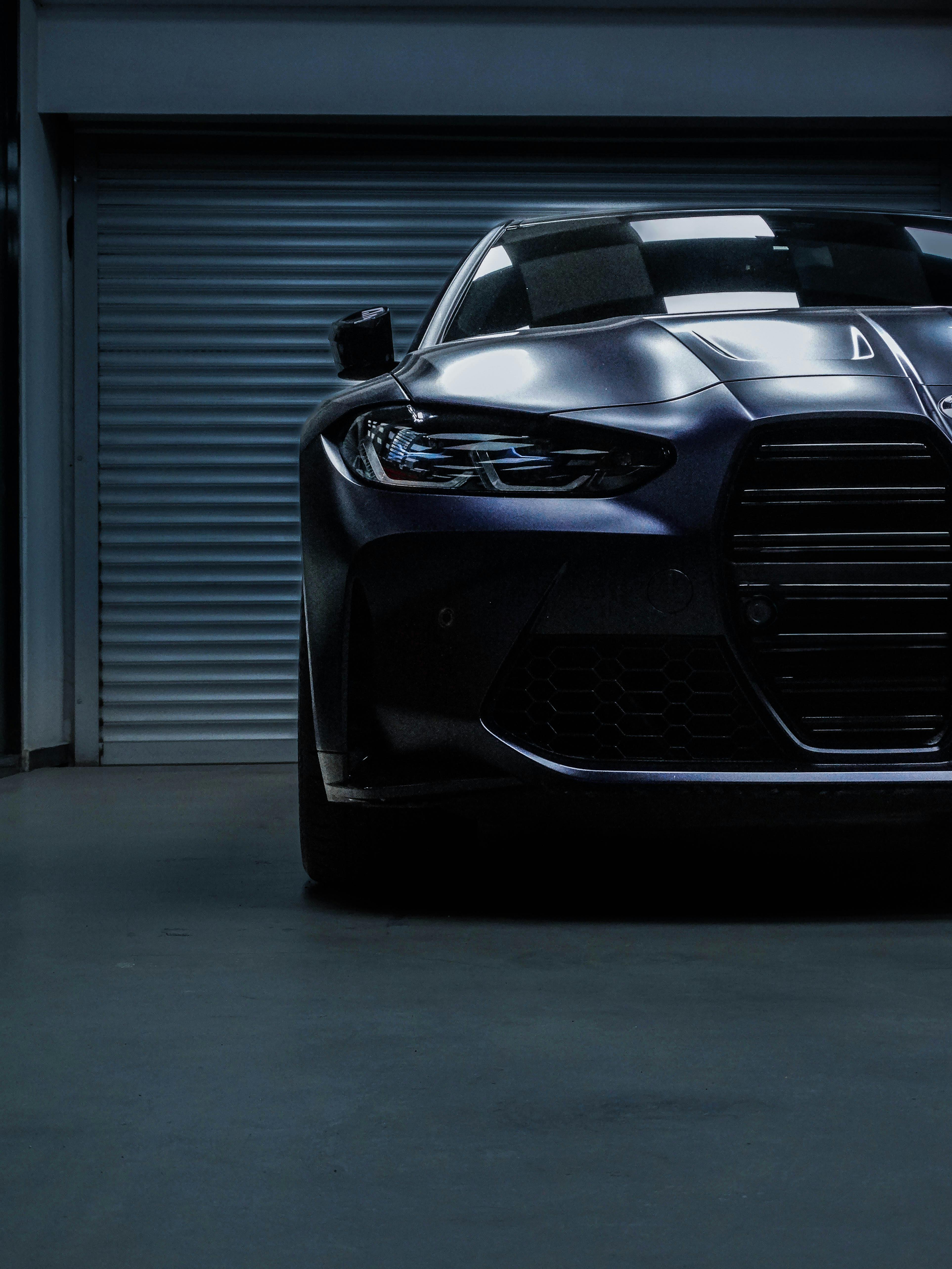 Sleek Luxury Sports Car Front View in Garage · Free Stock Photo