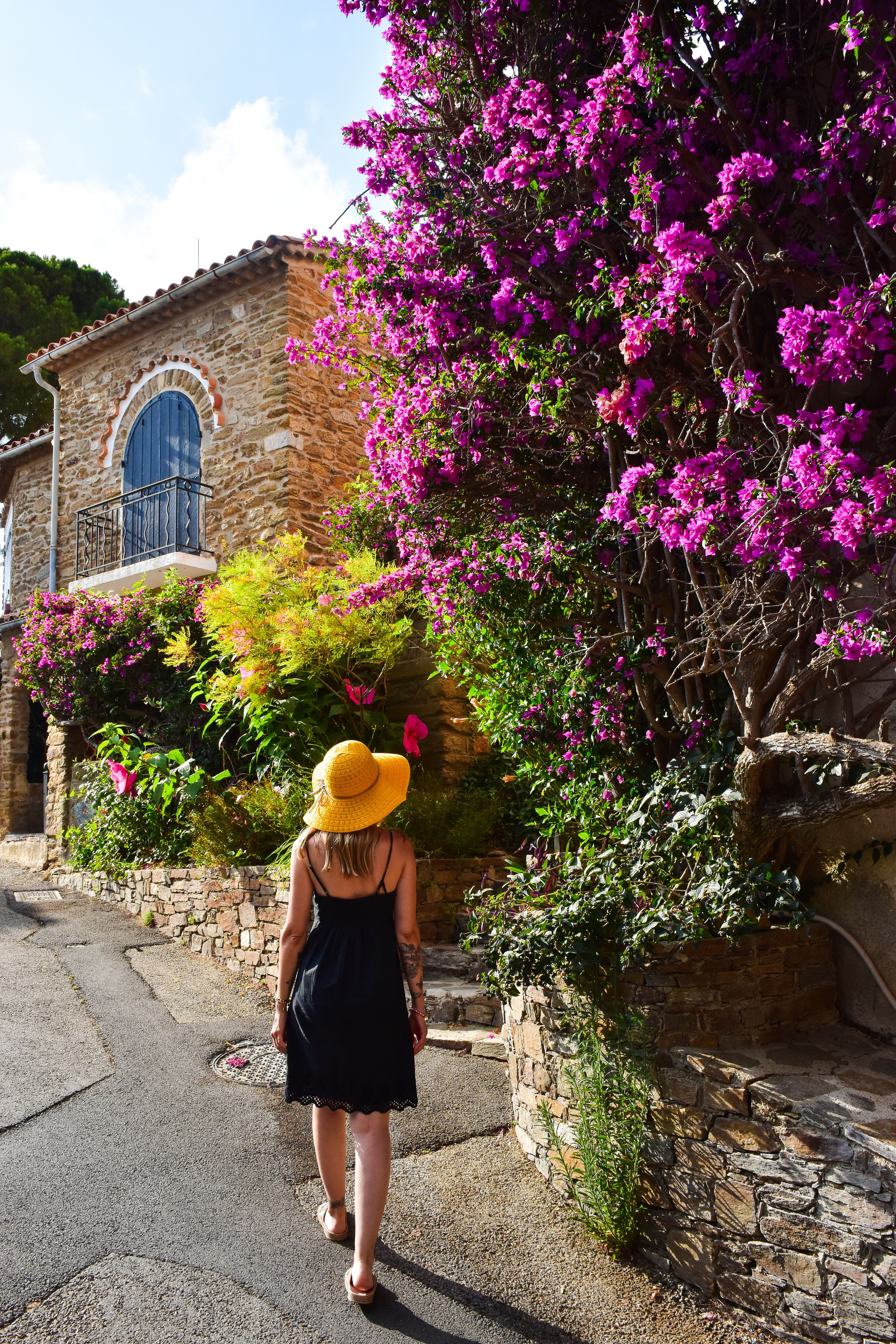 Woman Strolling Through Provence Village with Bougainvillea · Free ...