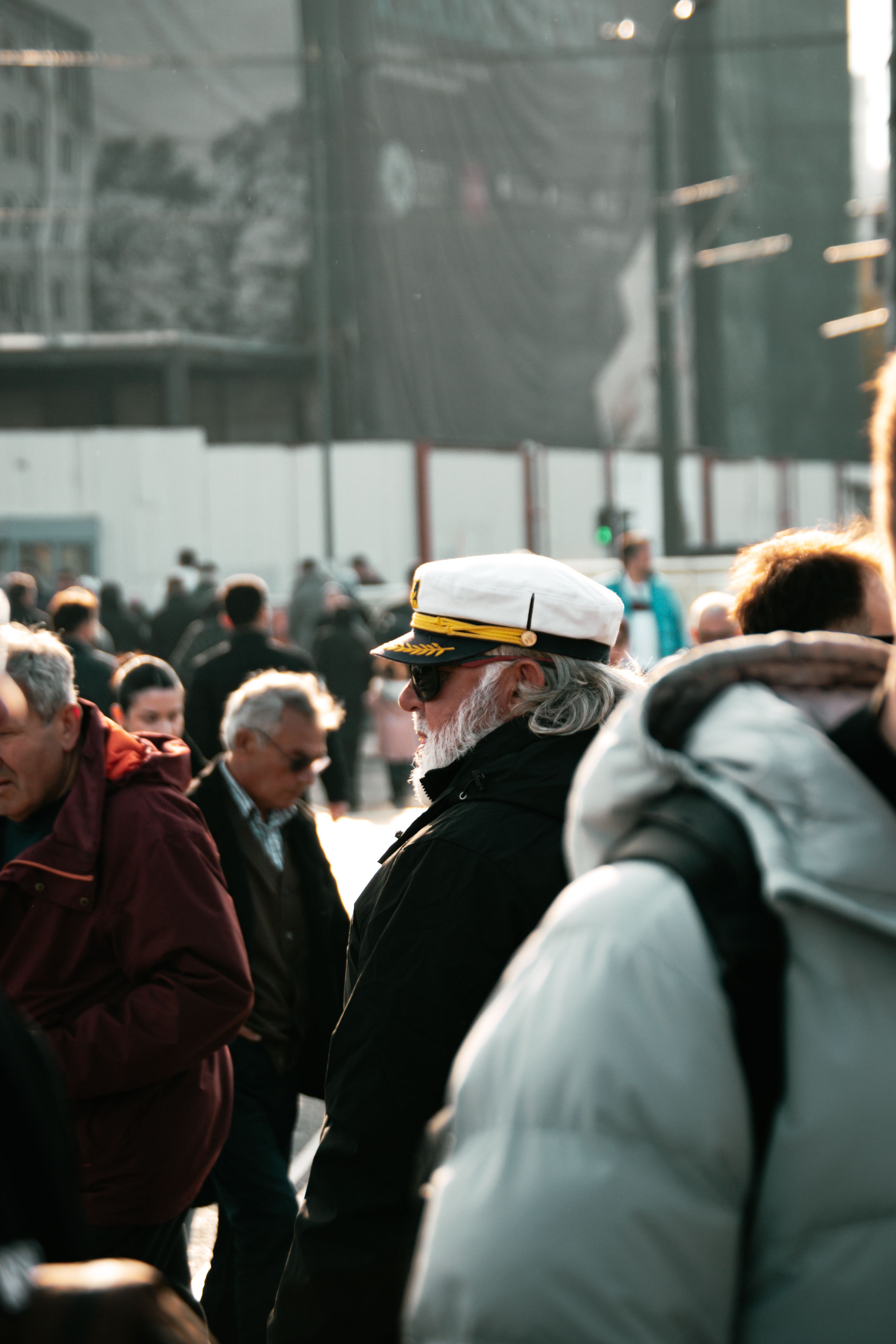 Crowded Urban Scene with Elderly Sailor · Free Stock Photo