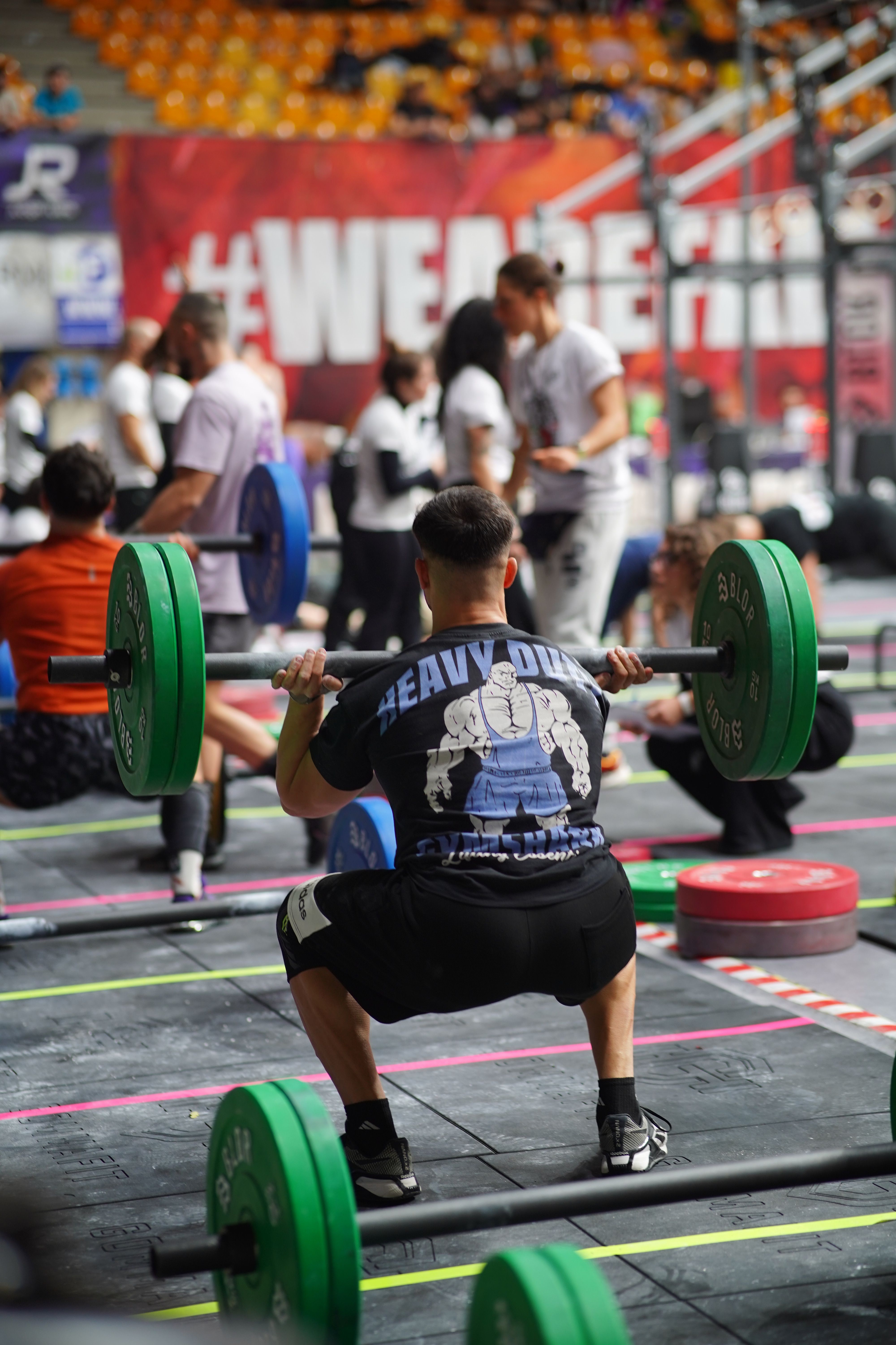 Man Weightlifting at Indoor Gym Event · Free Stock Photo