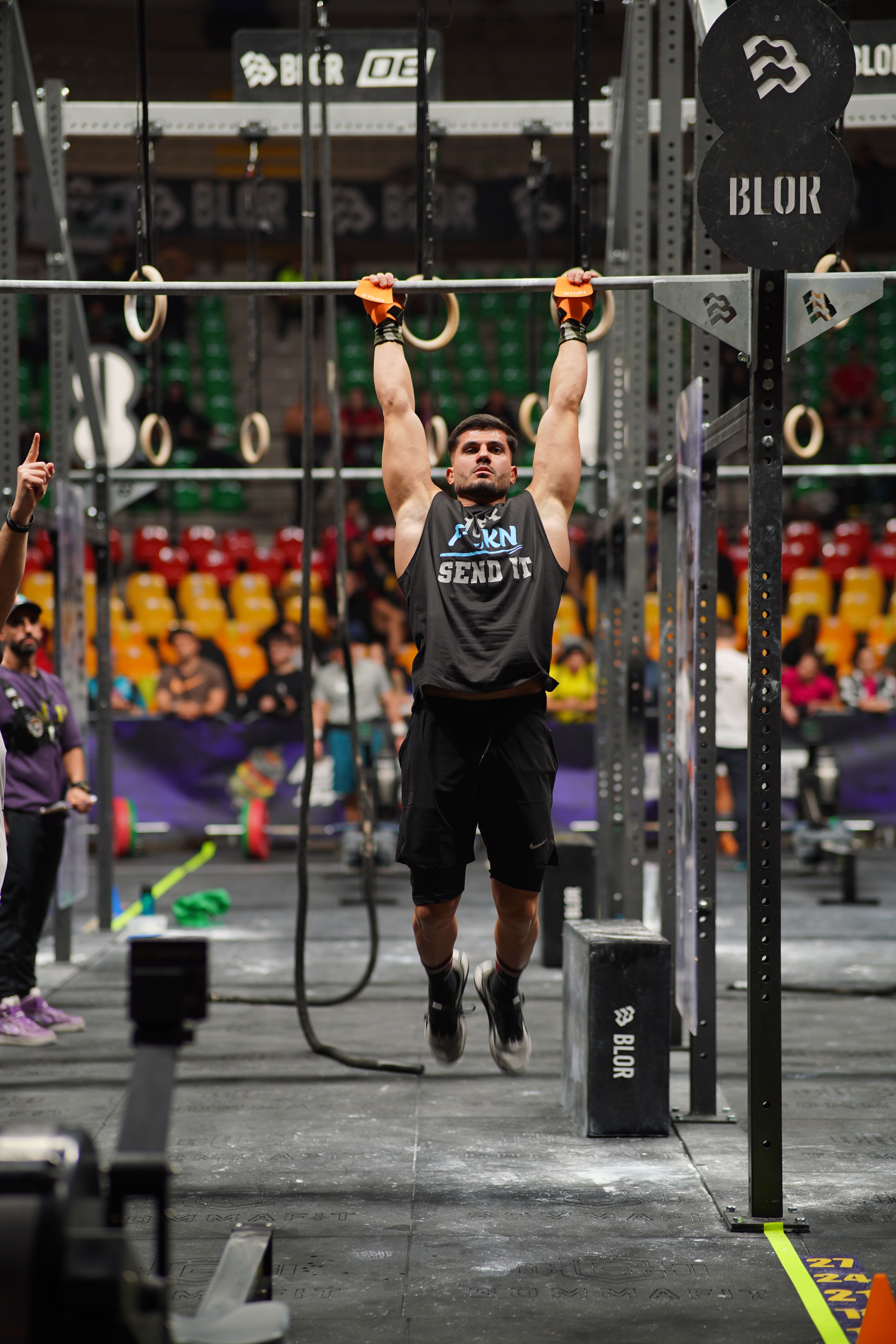 Athlete Performing Exercise at Indoor Gym Competition · Free Stock Photo