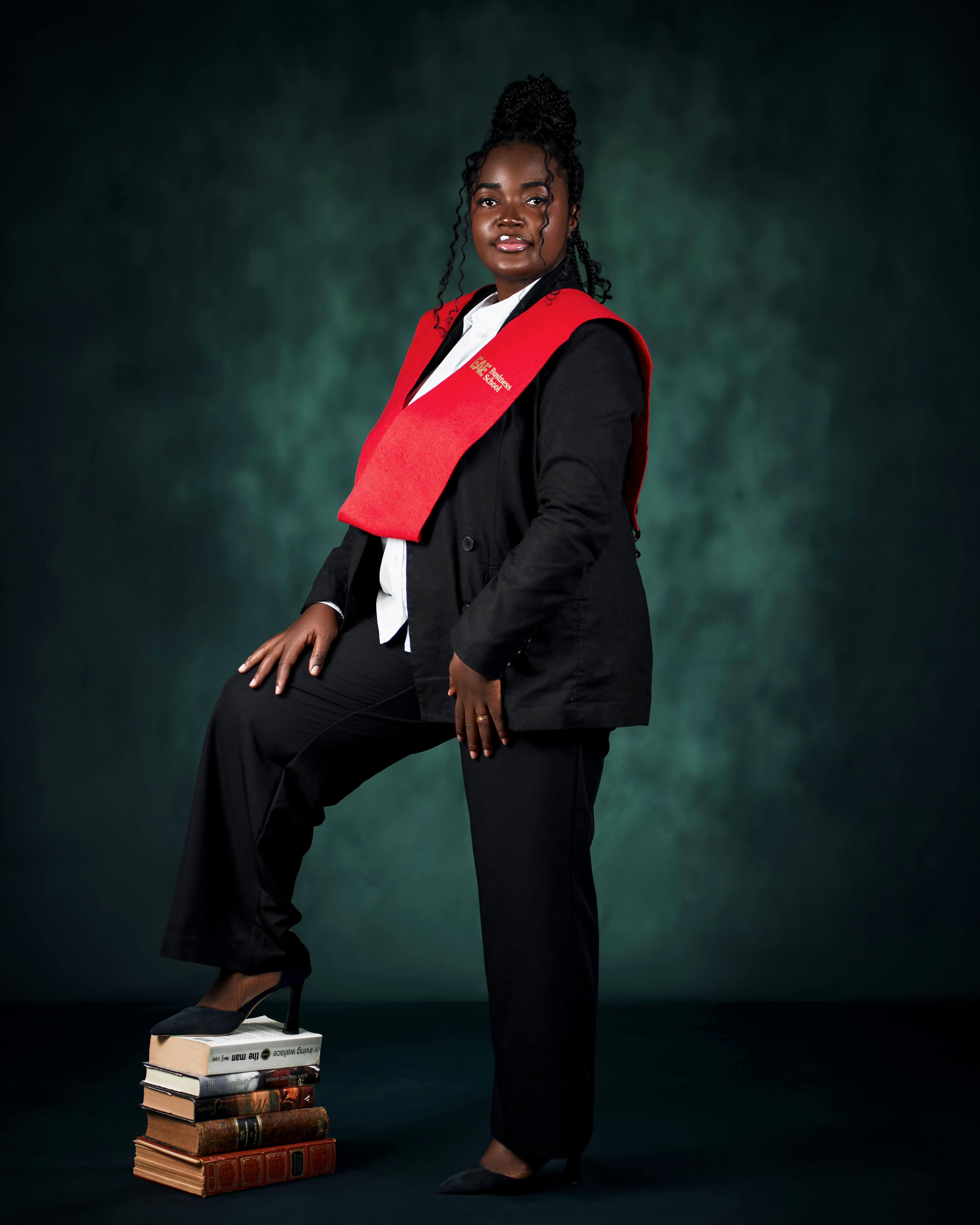 Elegant Graduate Portrait in Academic Attire · Free Stock Photo