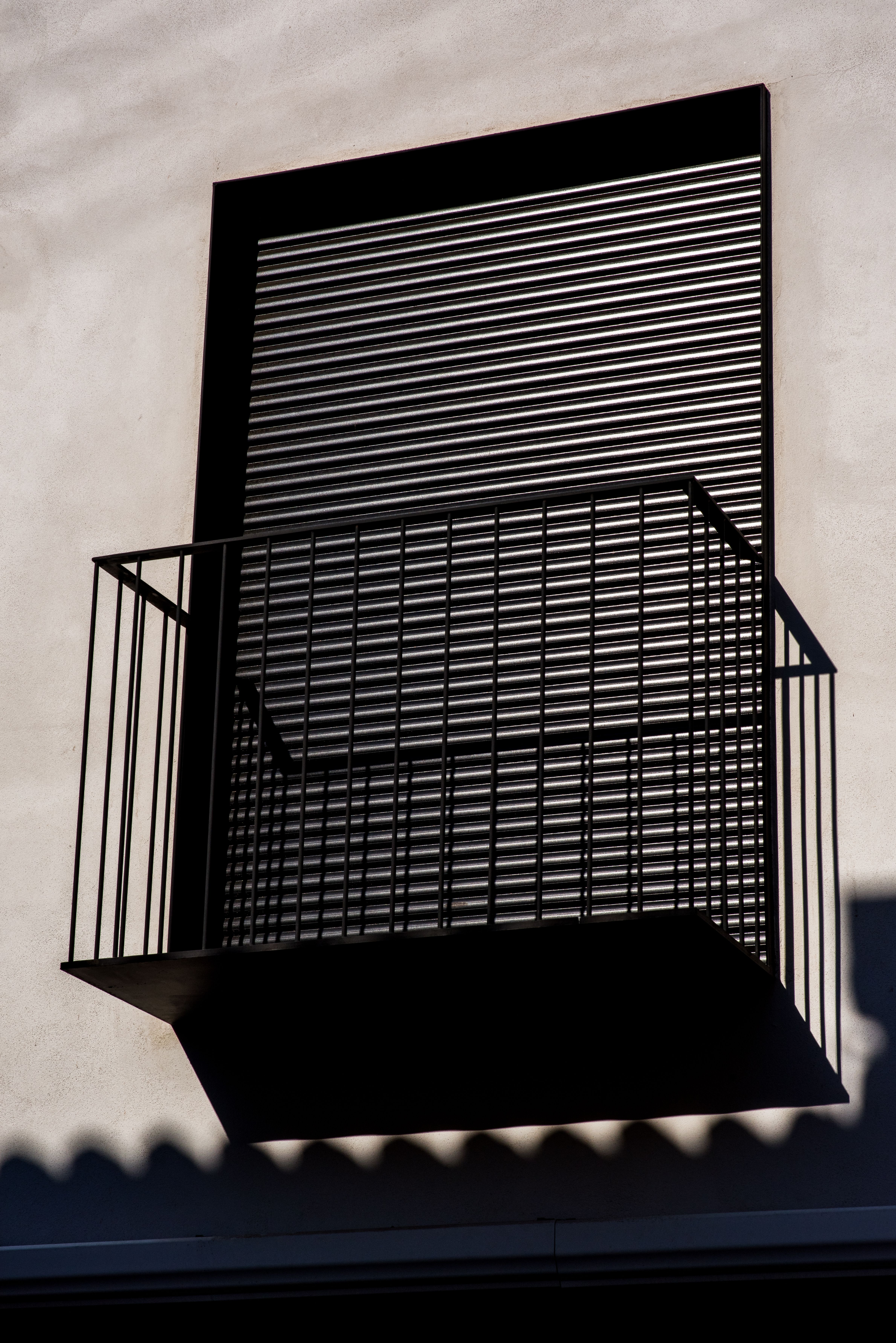 Modern Balcony with Metal Railing Shadow · Free Stock Photo