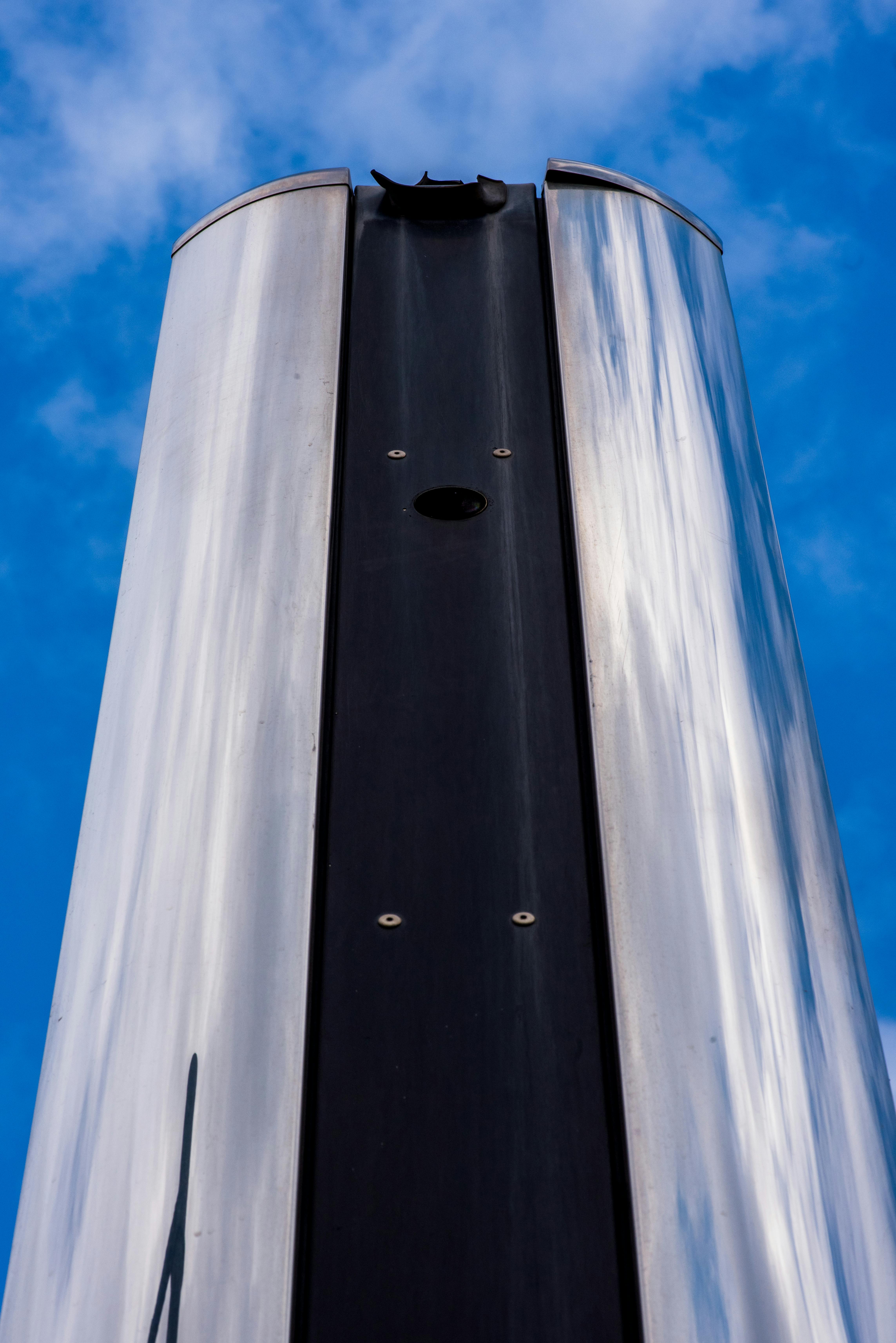 Reflective Metal Pole Against Blue Sky · Free Stock Photo
