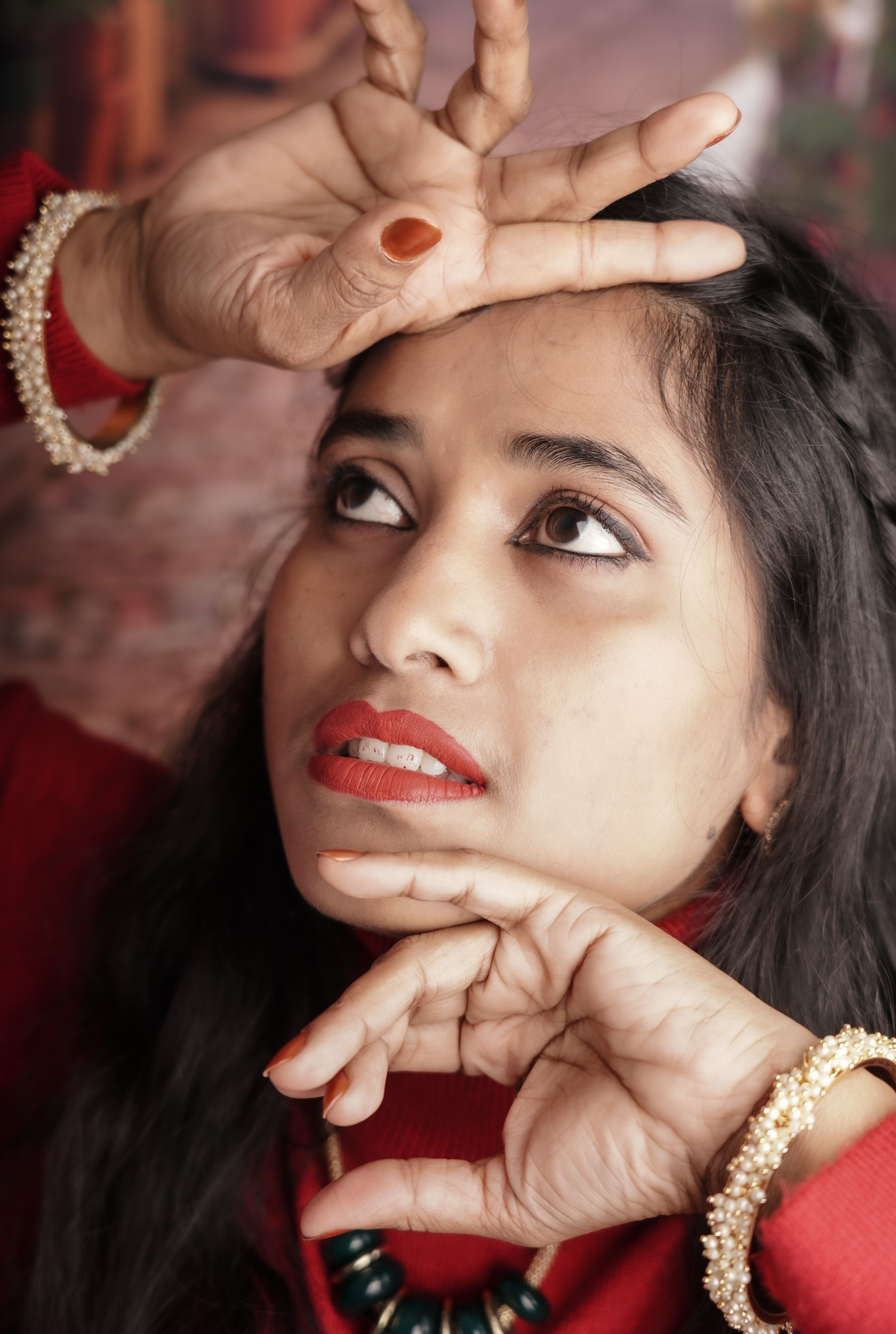 Portrait of a Woman with Artistic Hand Poses · Free Stock Photo